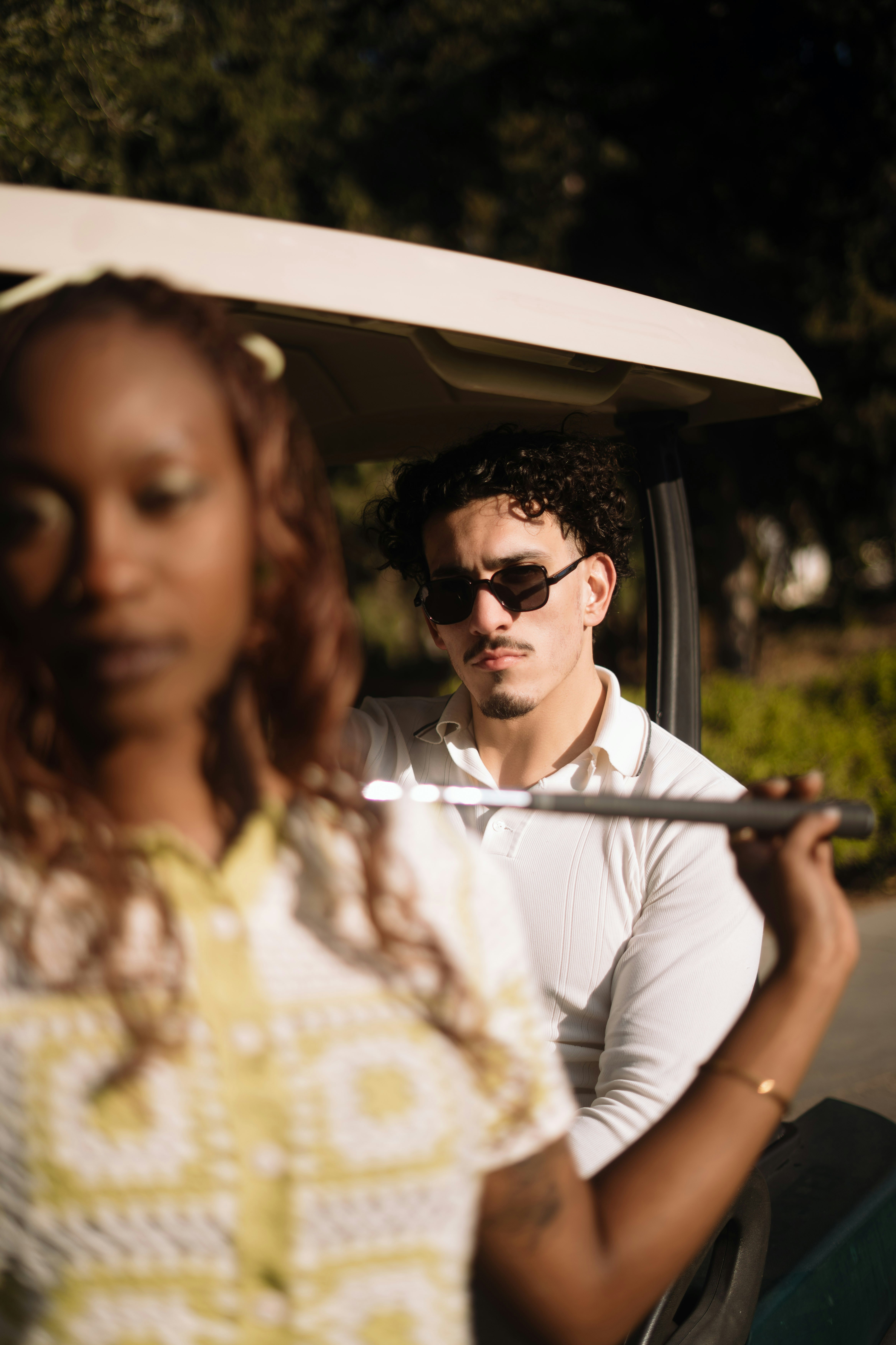 Shadowed Gaze: The Man in the Backseat of the Golf Cart
