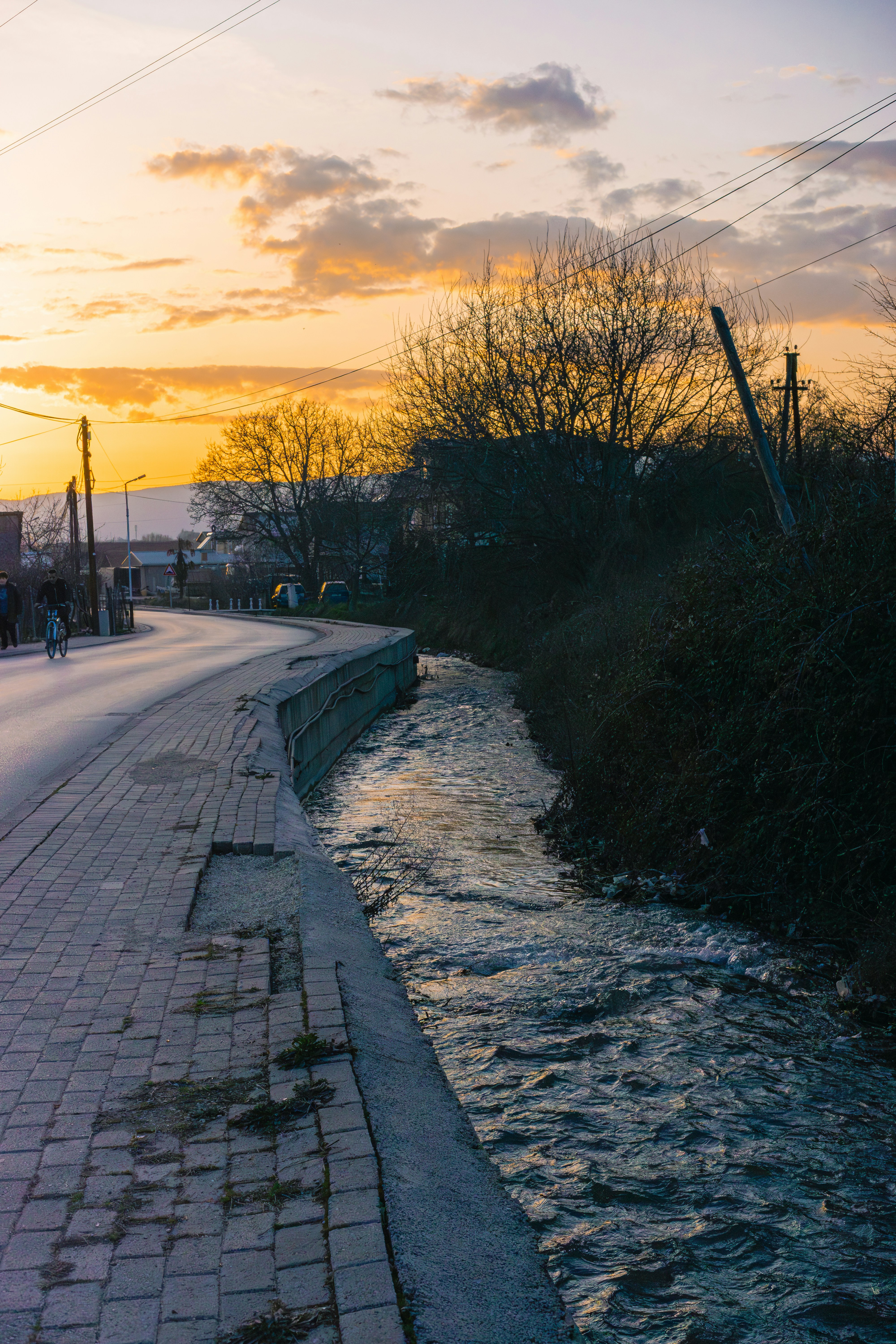 Sunset along the canal: a quiet riverside promenade