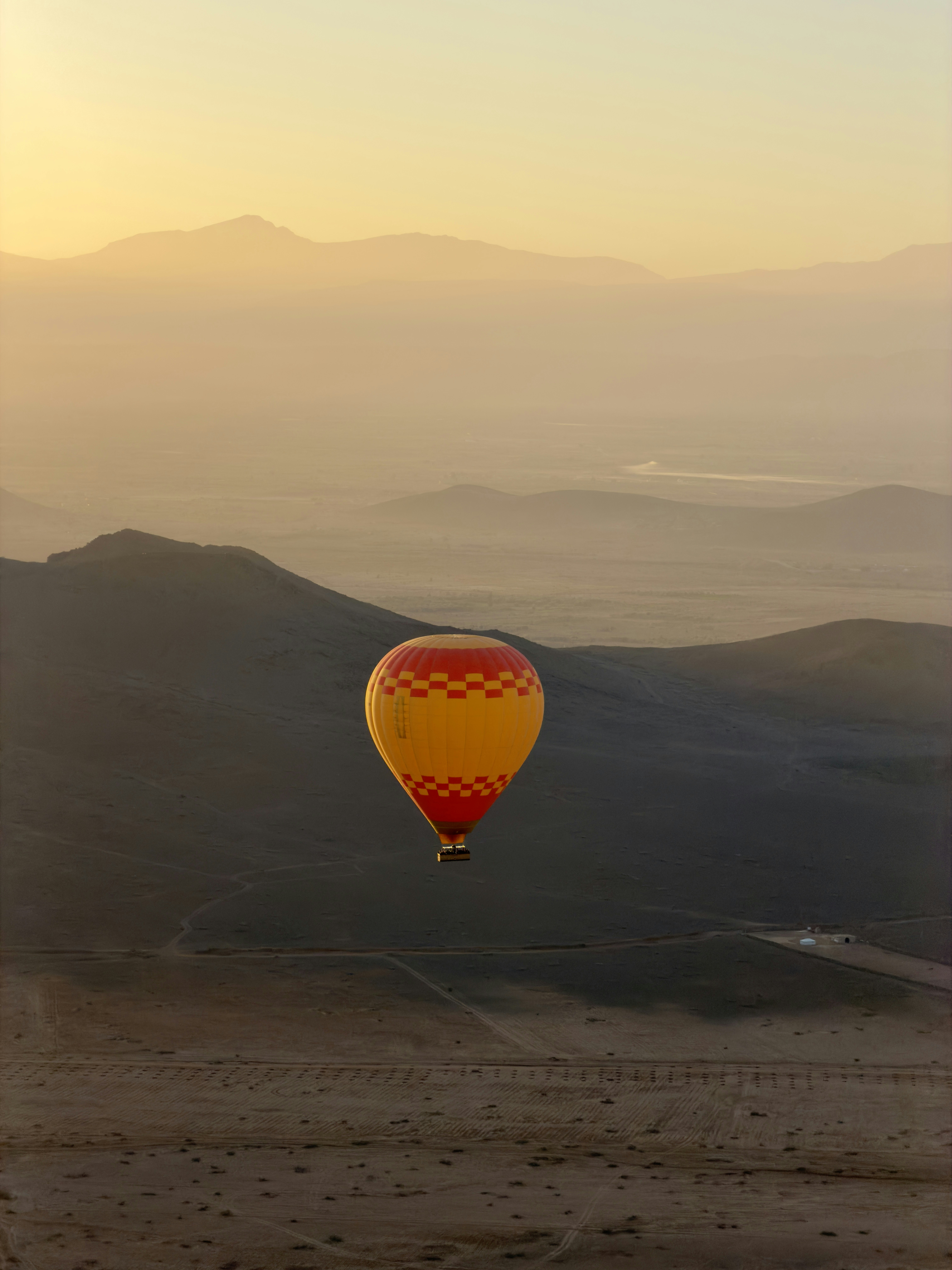 Balloon Over Distant Sands at Golden Hour