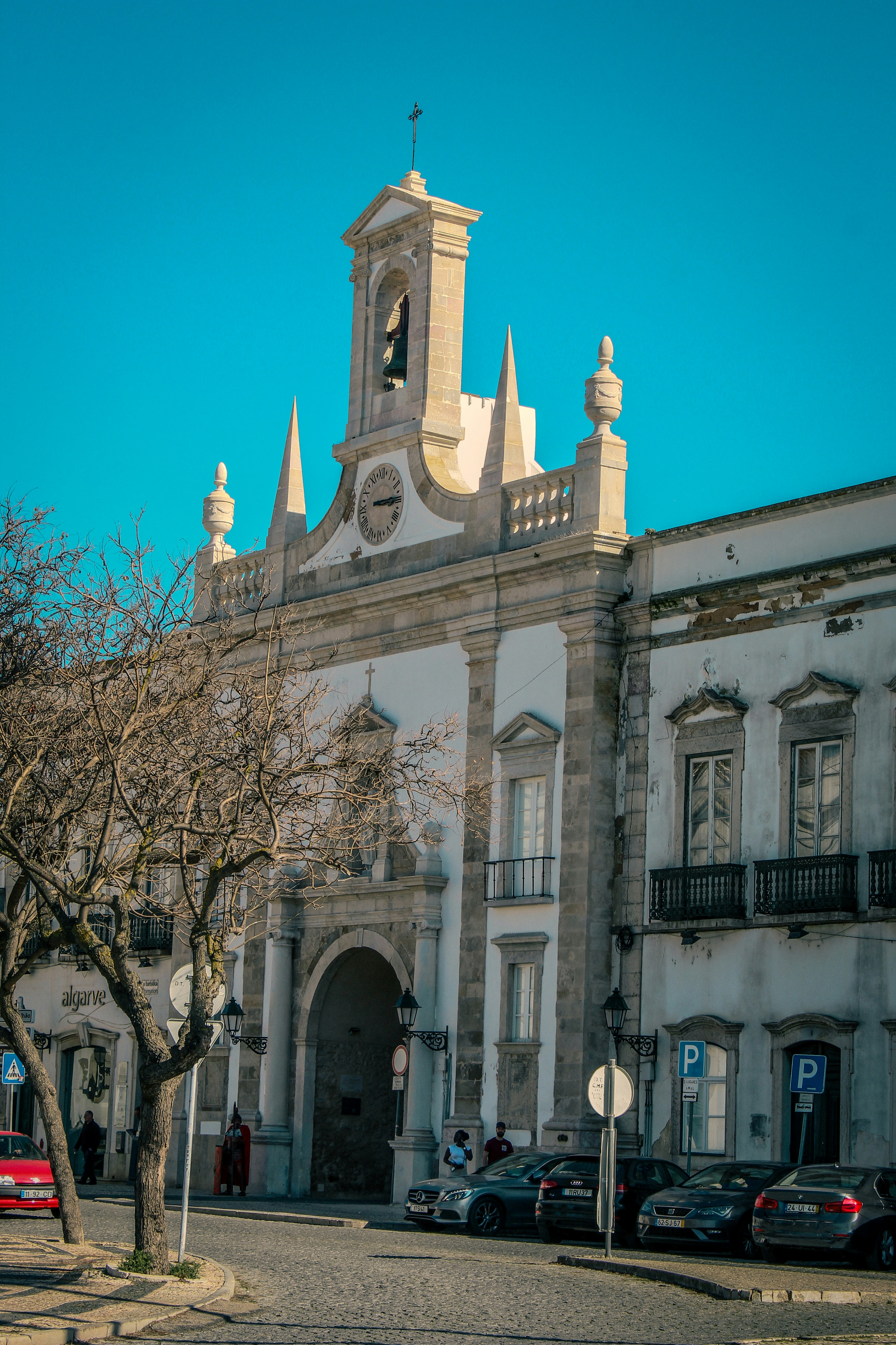 Baroque Clocktower Facade under a Cerulean Sky