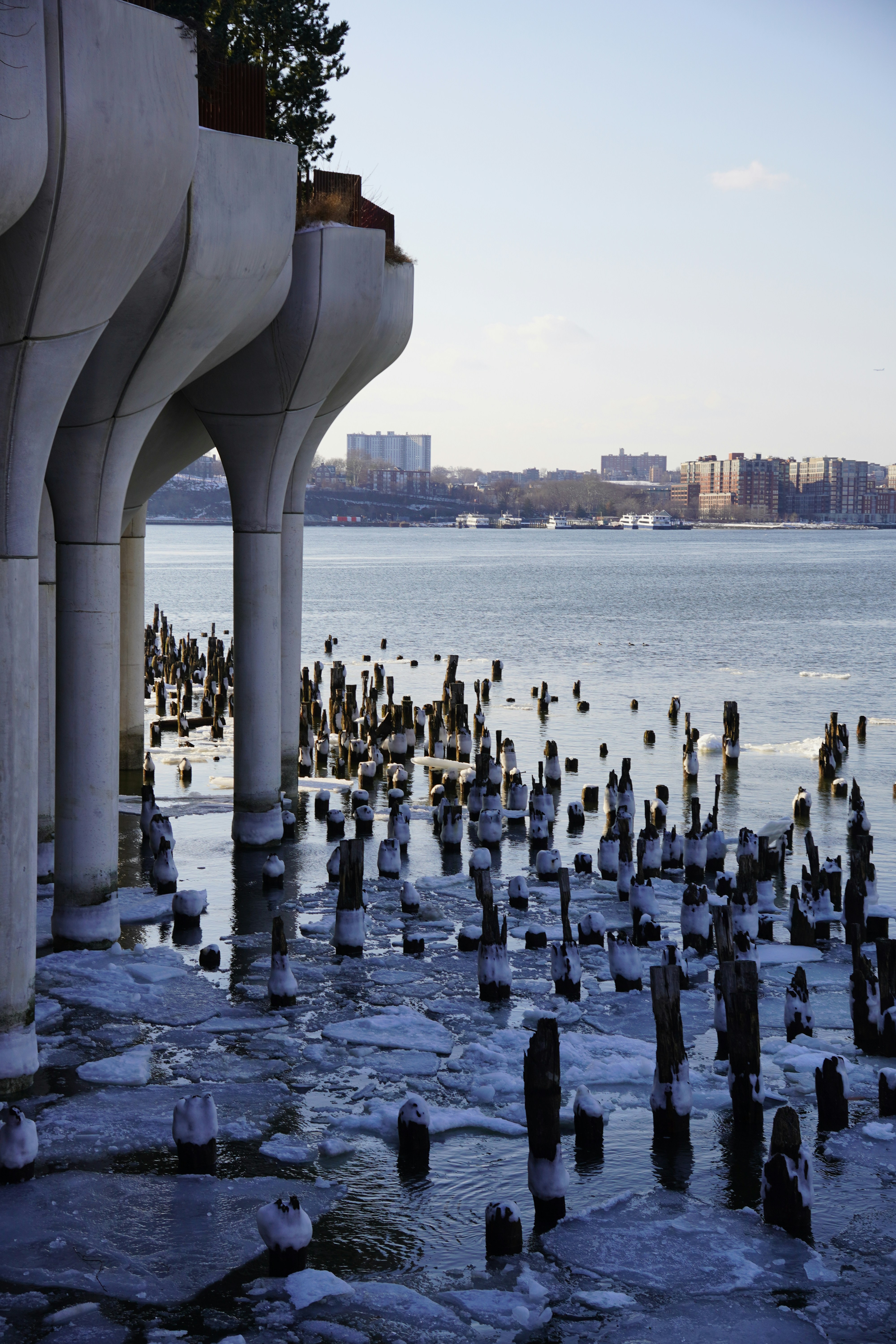 Pier Columns over a Winter Sea: An Industrial-Serene Riverside