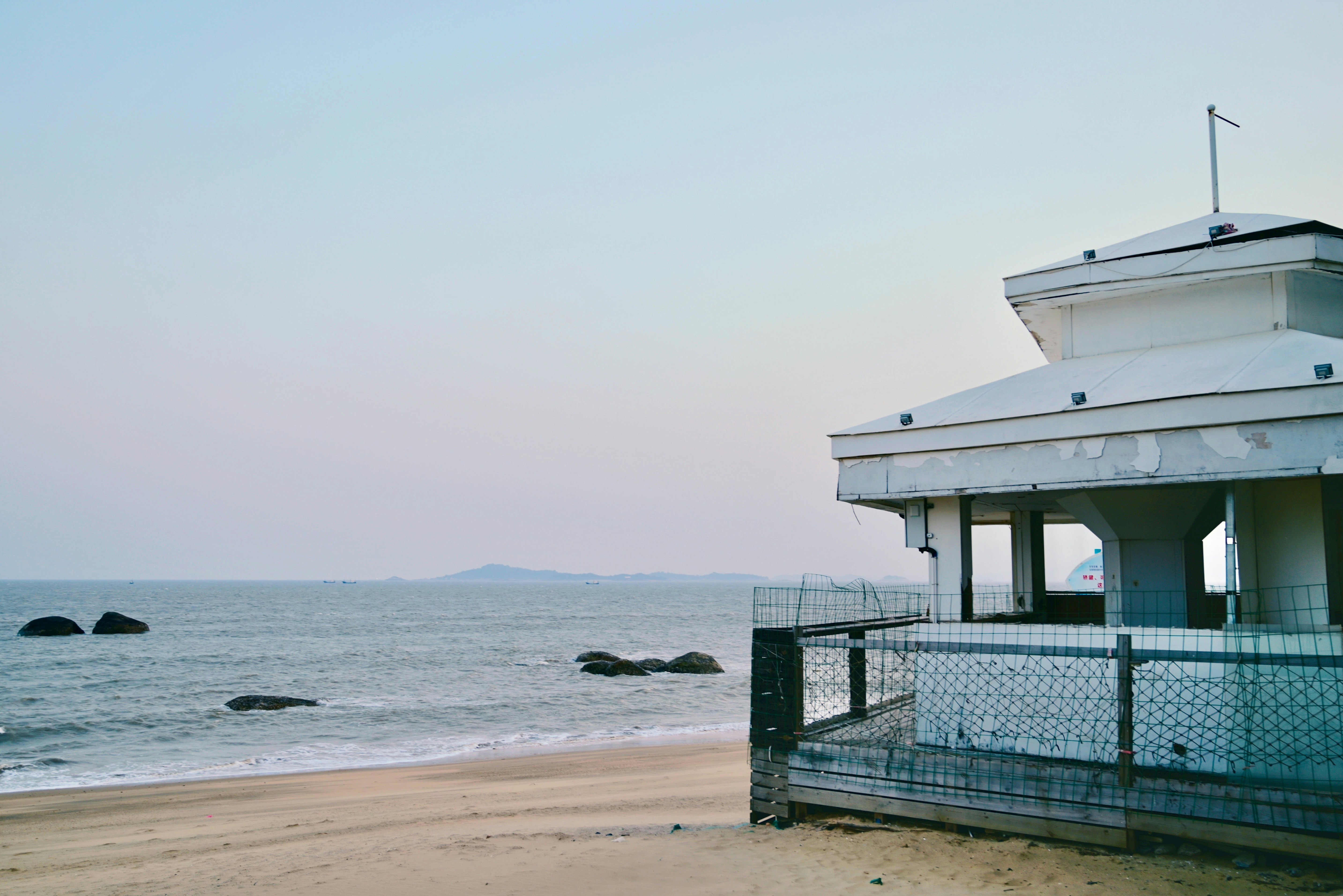 Coastal Pavilion at Dusk: A Quiet Strand by the Seascape Structure