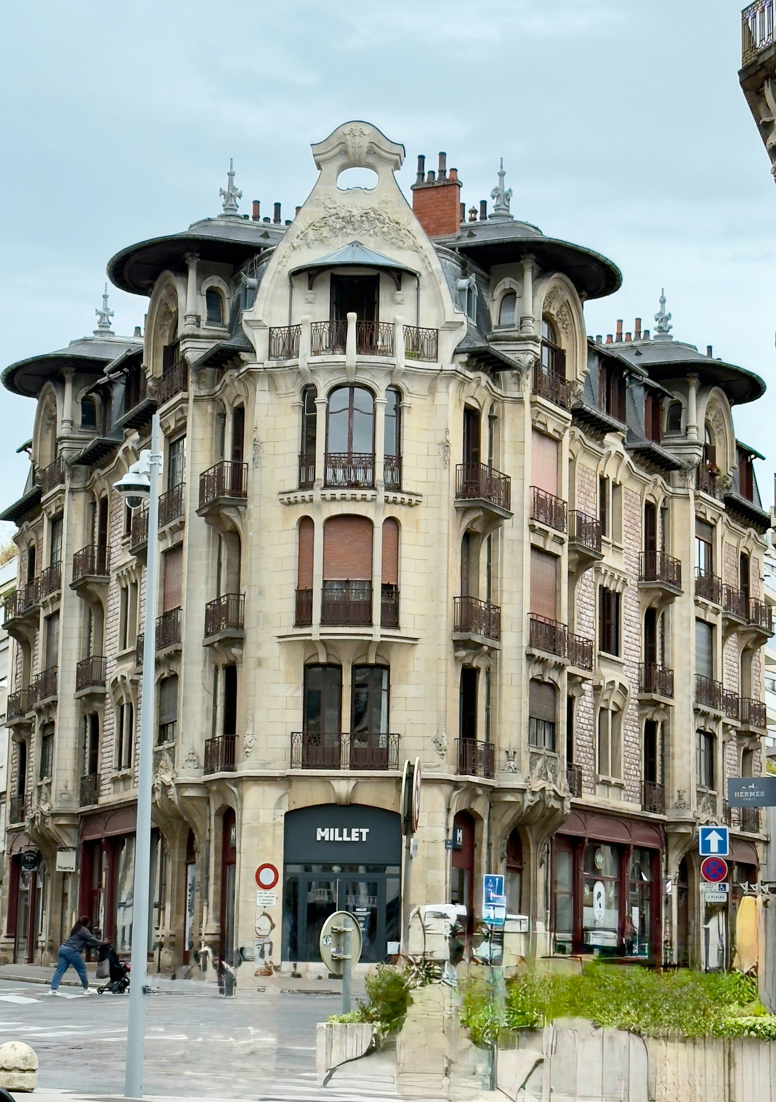 Facade of an Elegant Beaux-Arts Corner Building in Urban Basque-Style Setting