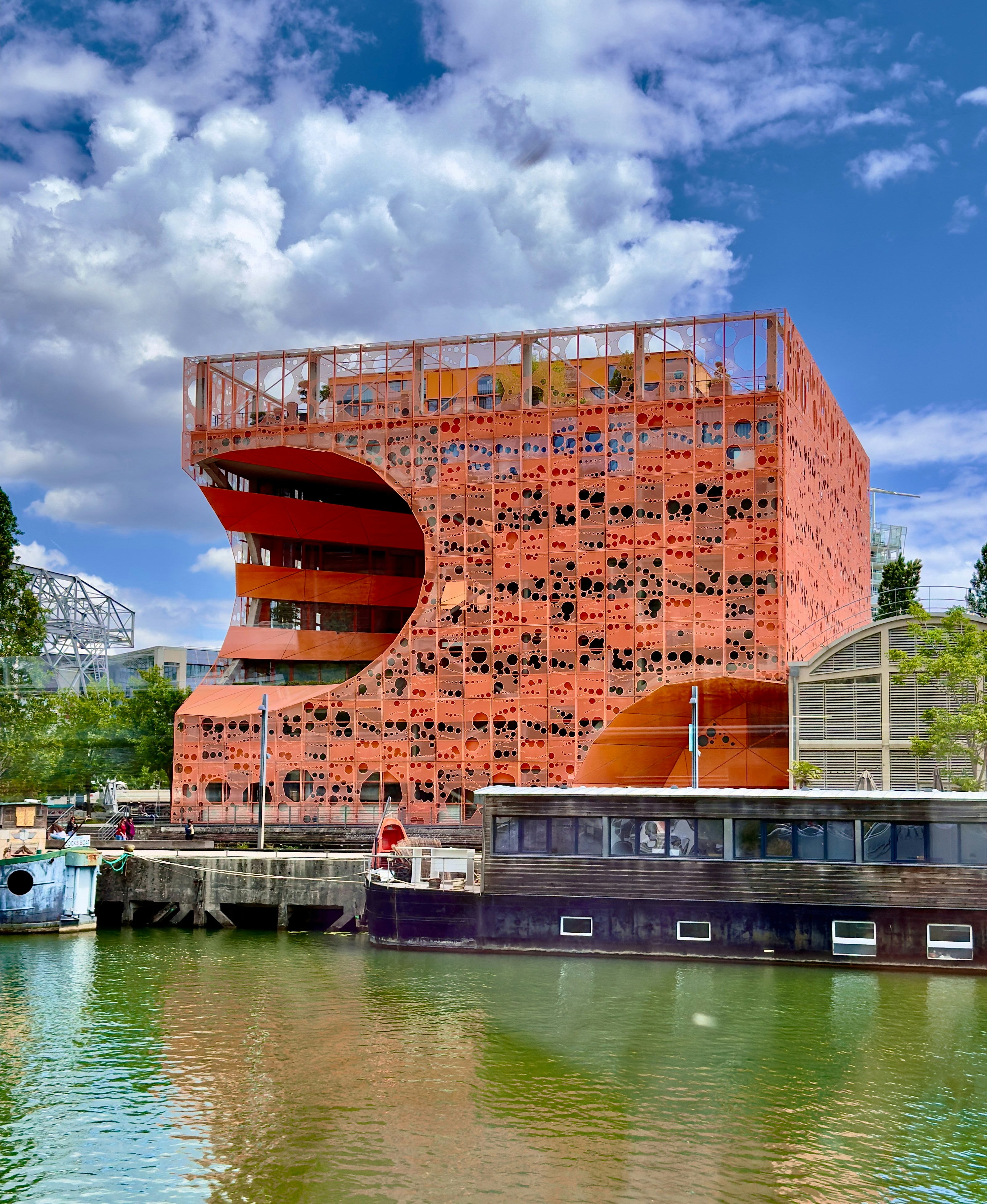 Brickwork by the Water: The Orange Facade of the Floating Complex
