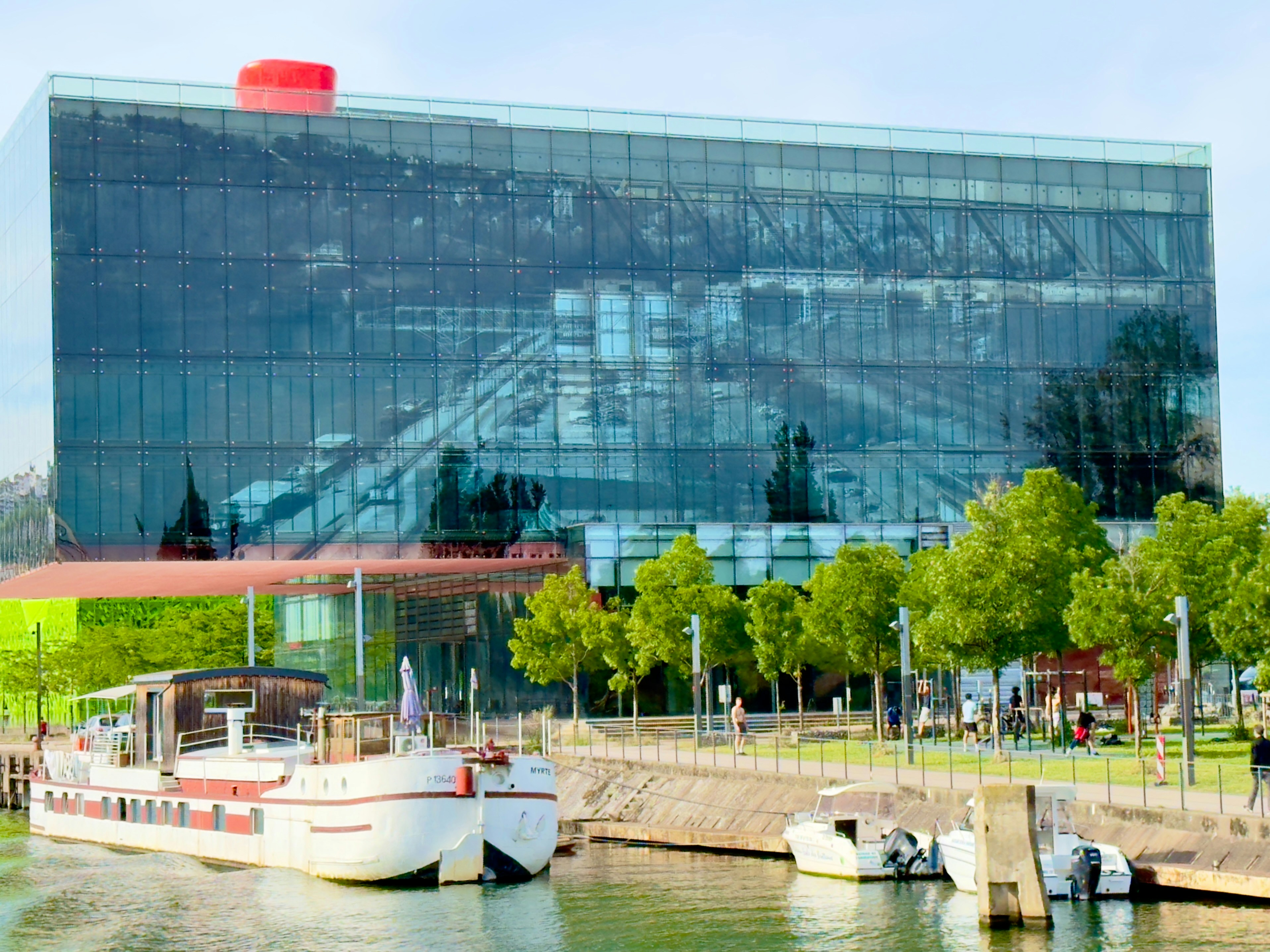 Glass Facade, Green Park, and Waterfront Boats