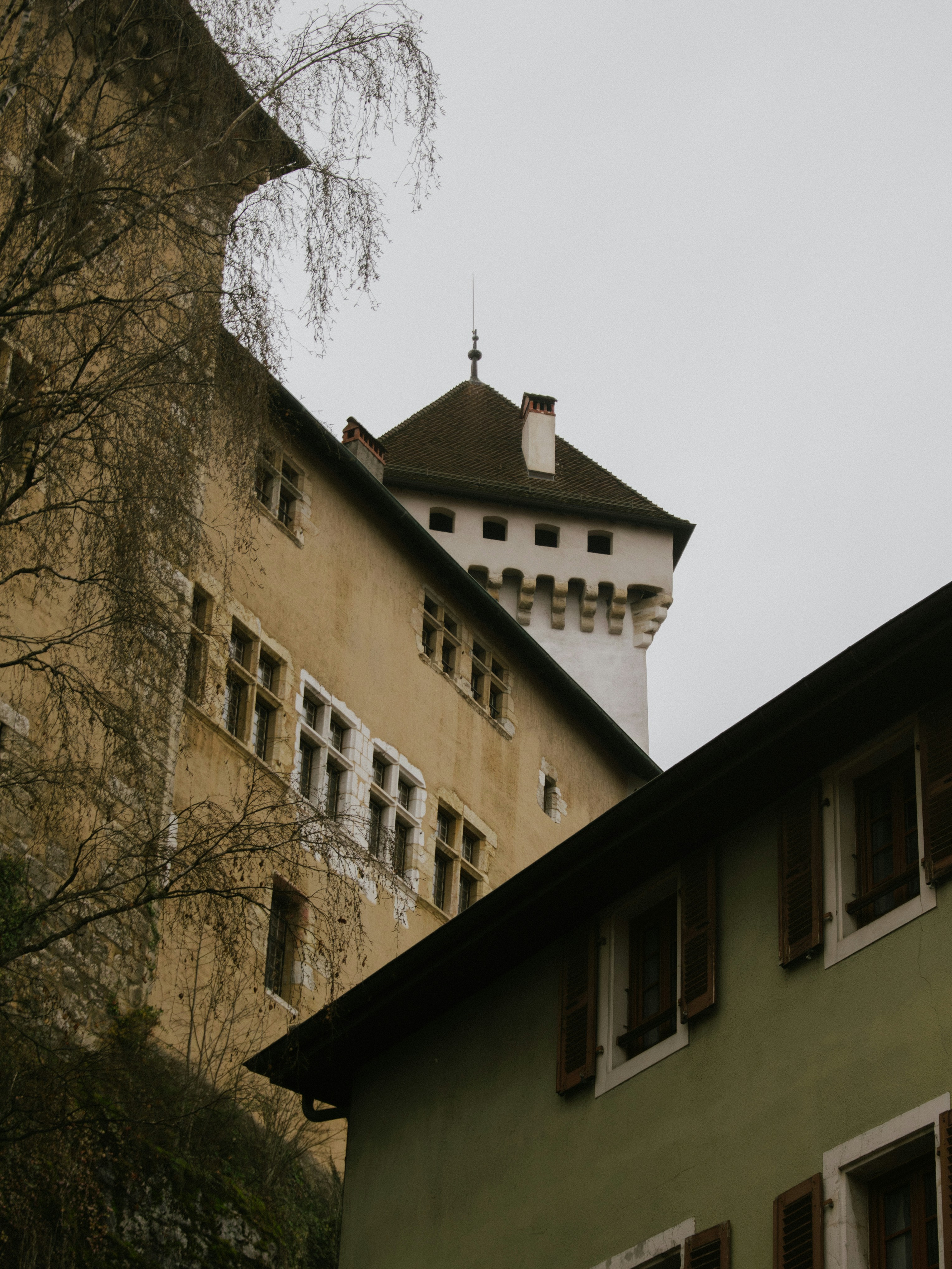 Old Town Tower Watching Over Slanted Rooflines