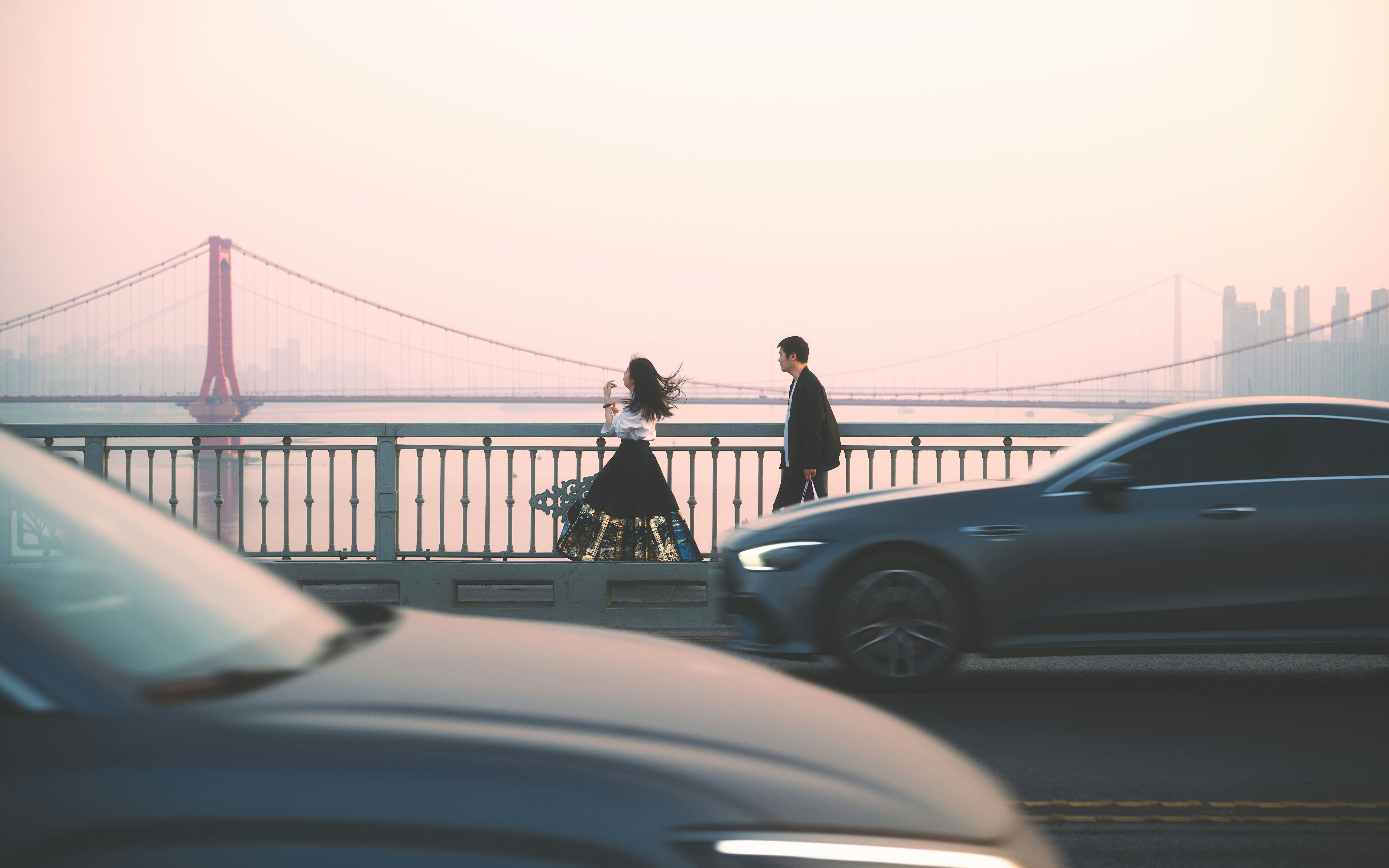 Across the Riverwalk: Quiet Encounter by the Moving Line