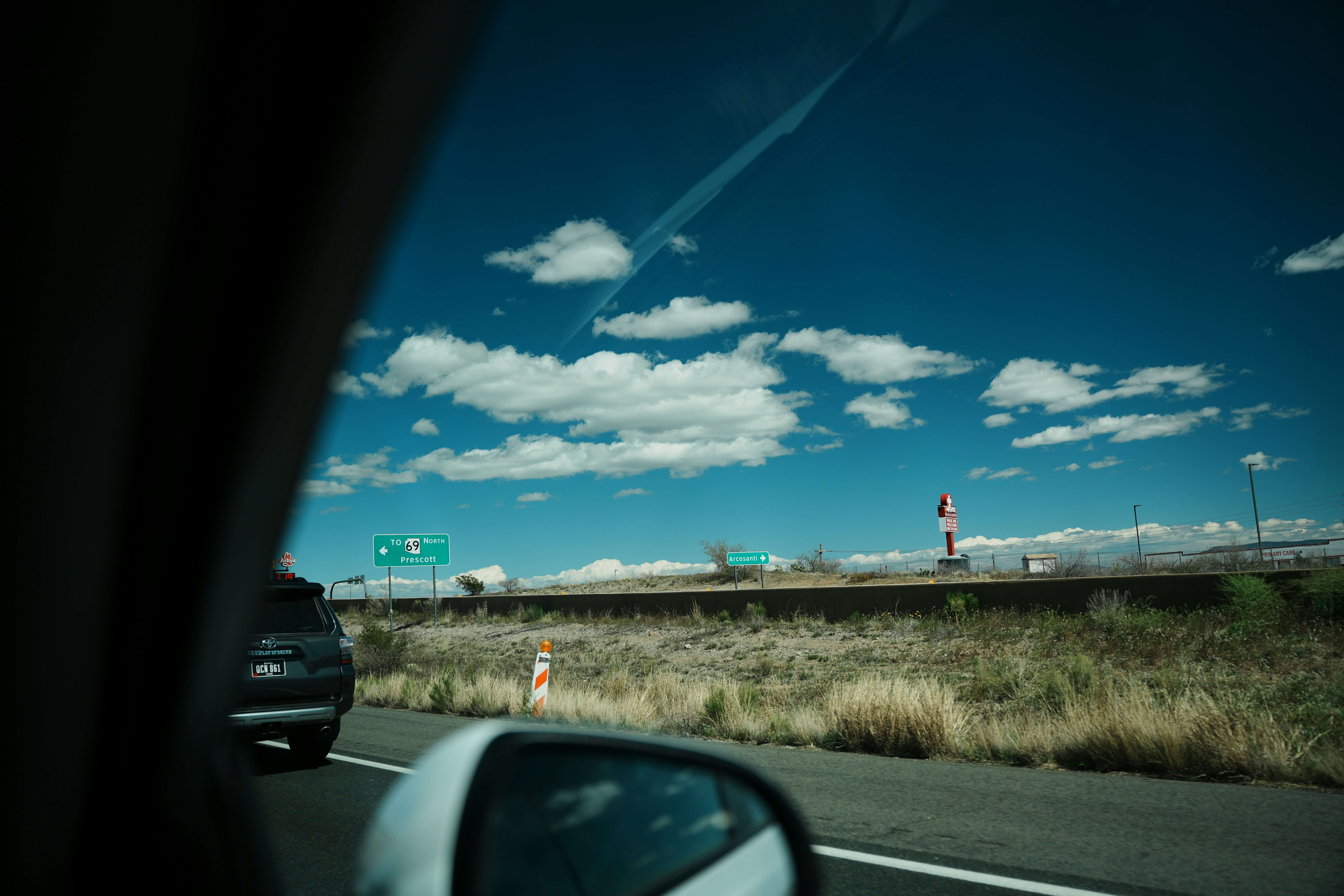 Horizon Route: Highway Scene Framed by Car Window