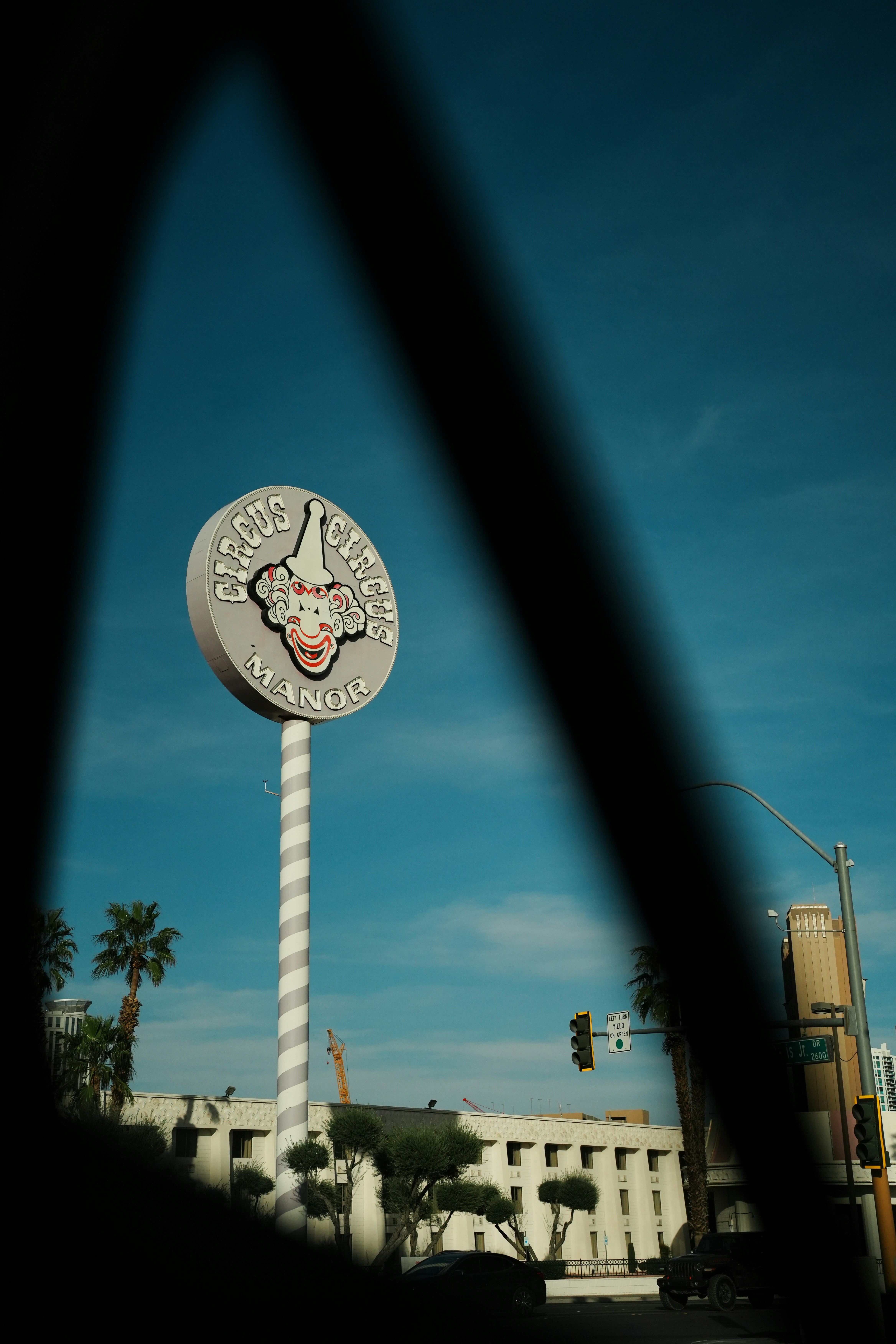 Neon Clown at the Edge of the Frame