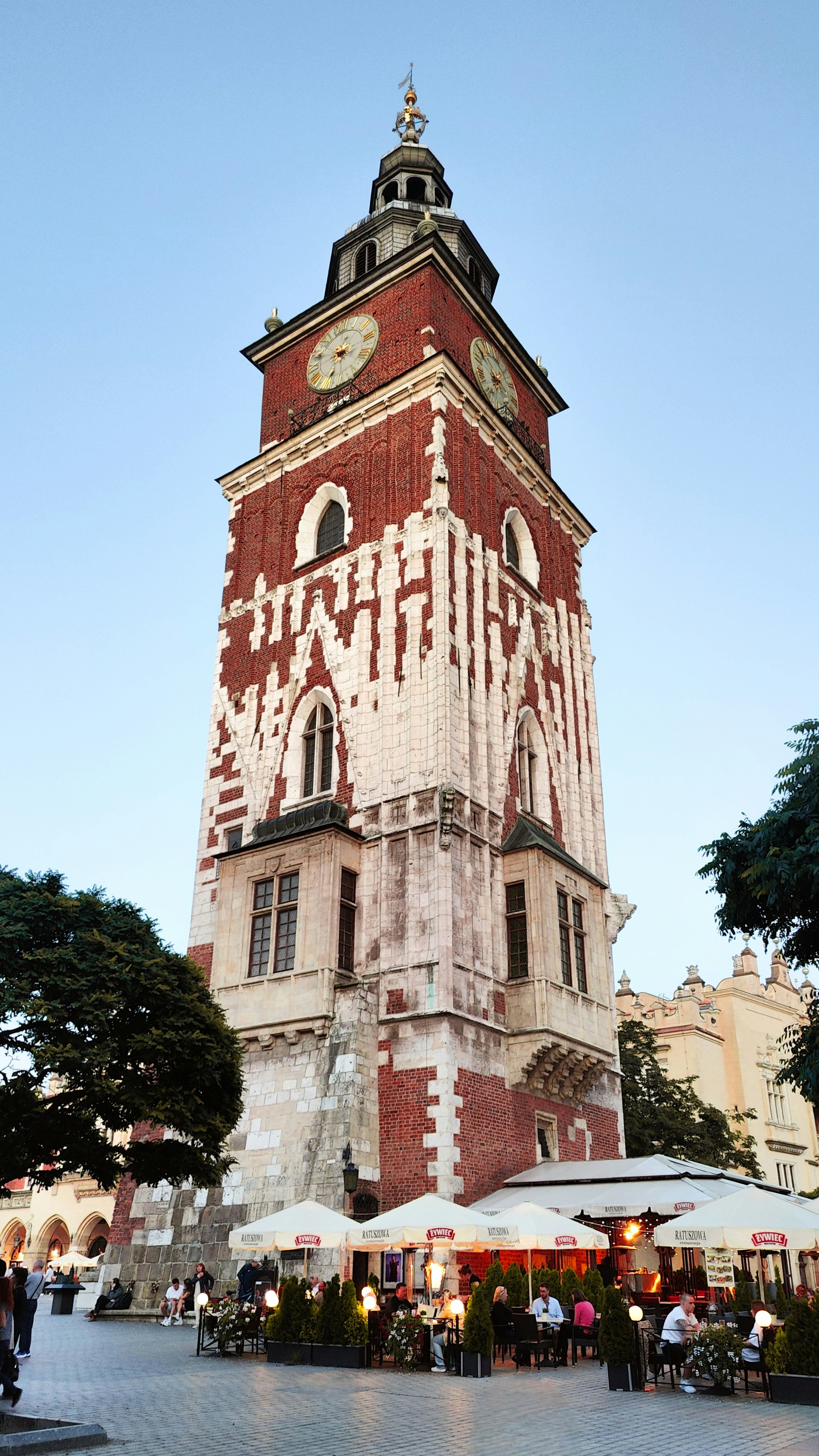 The Brick Bell-Tower Rising Over a Laid-Back Square