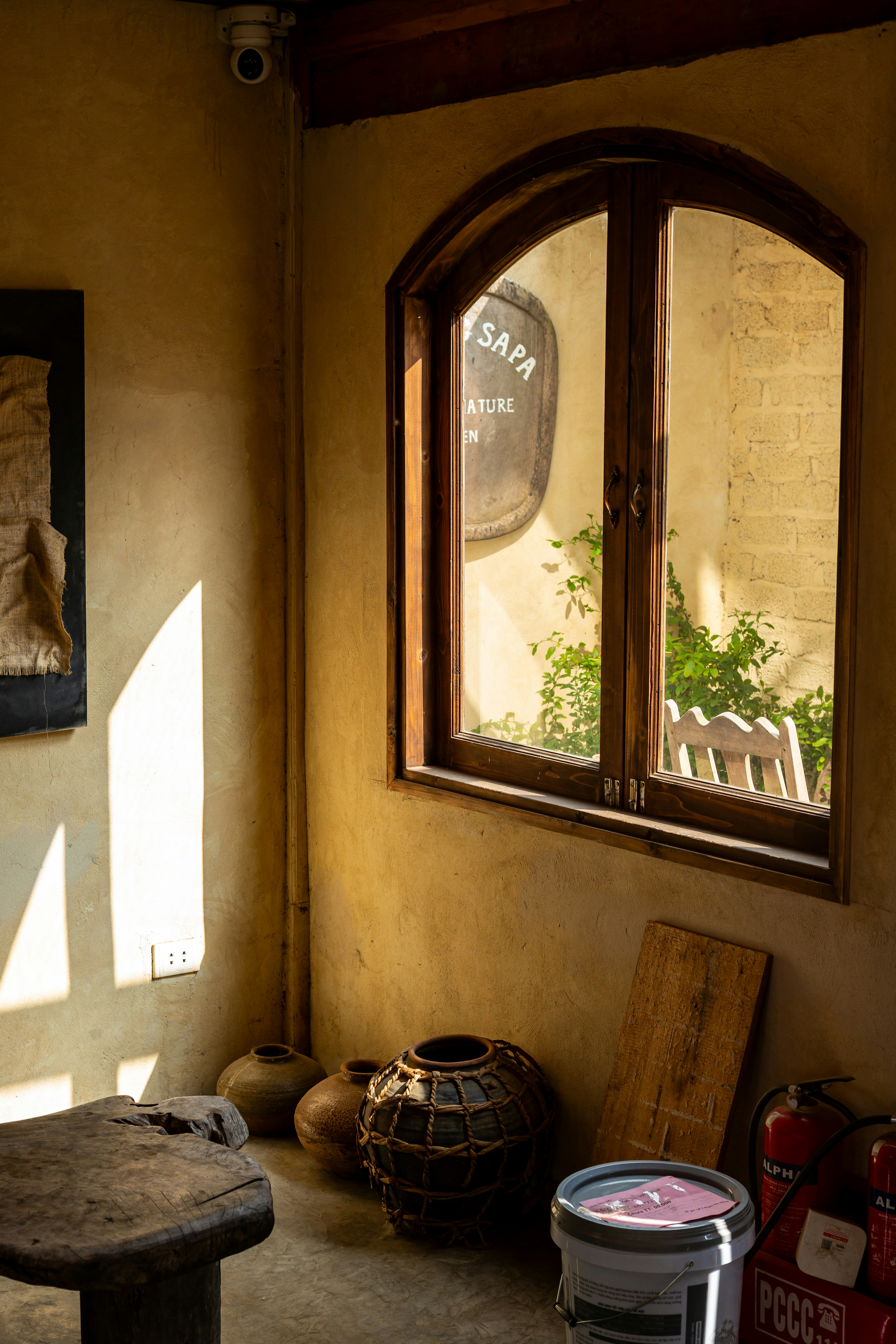 Sunlit Window Nook: Earthy Stillness in a Rustic Interior