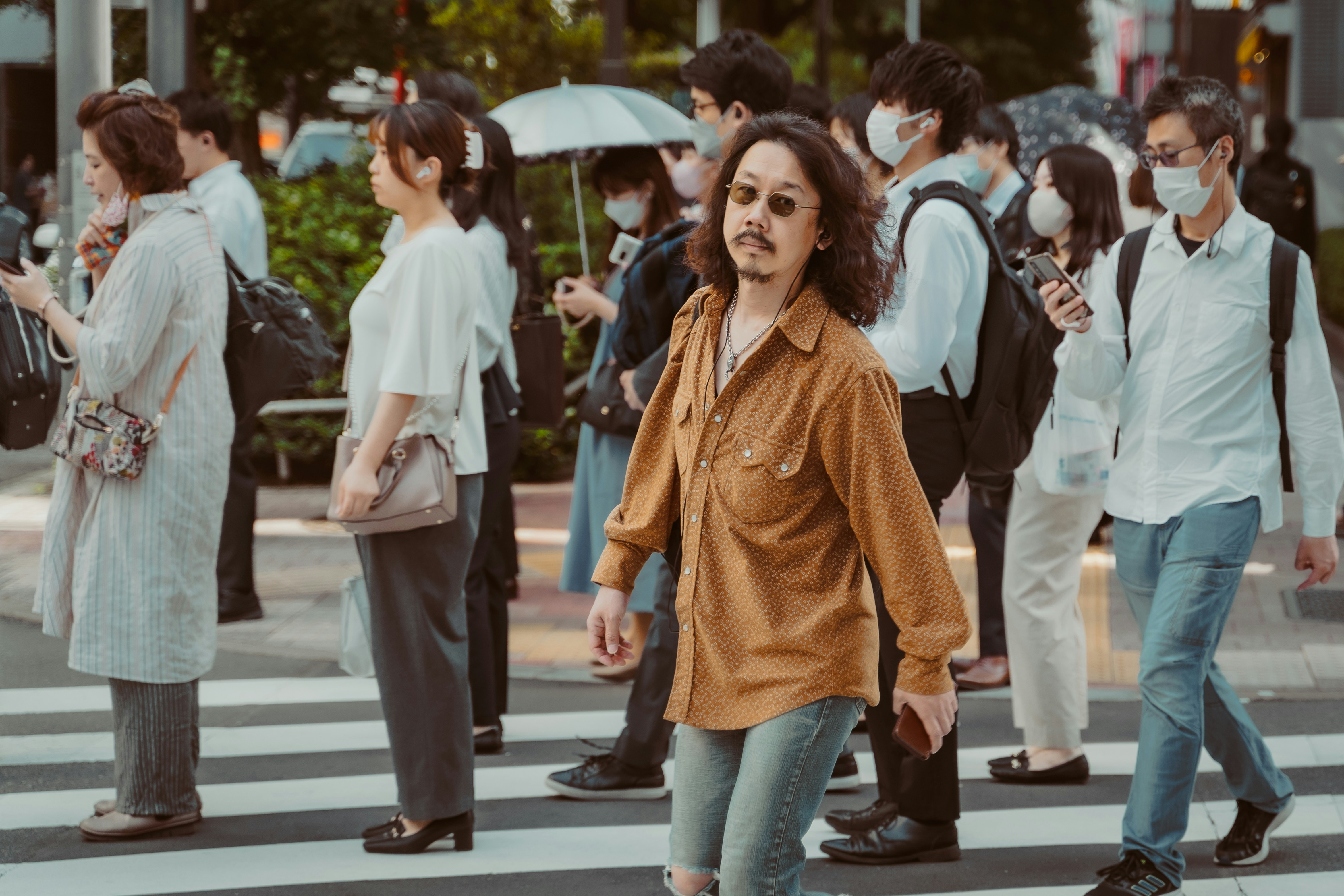 Crosswalk Mosaic: A Wanderer Steps Forward Among the City Crowd
