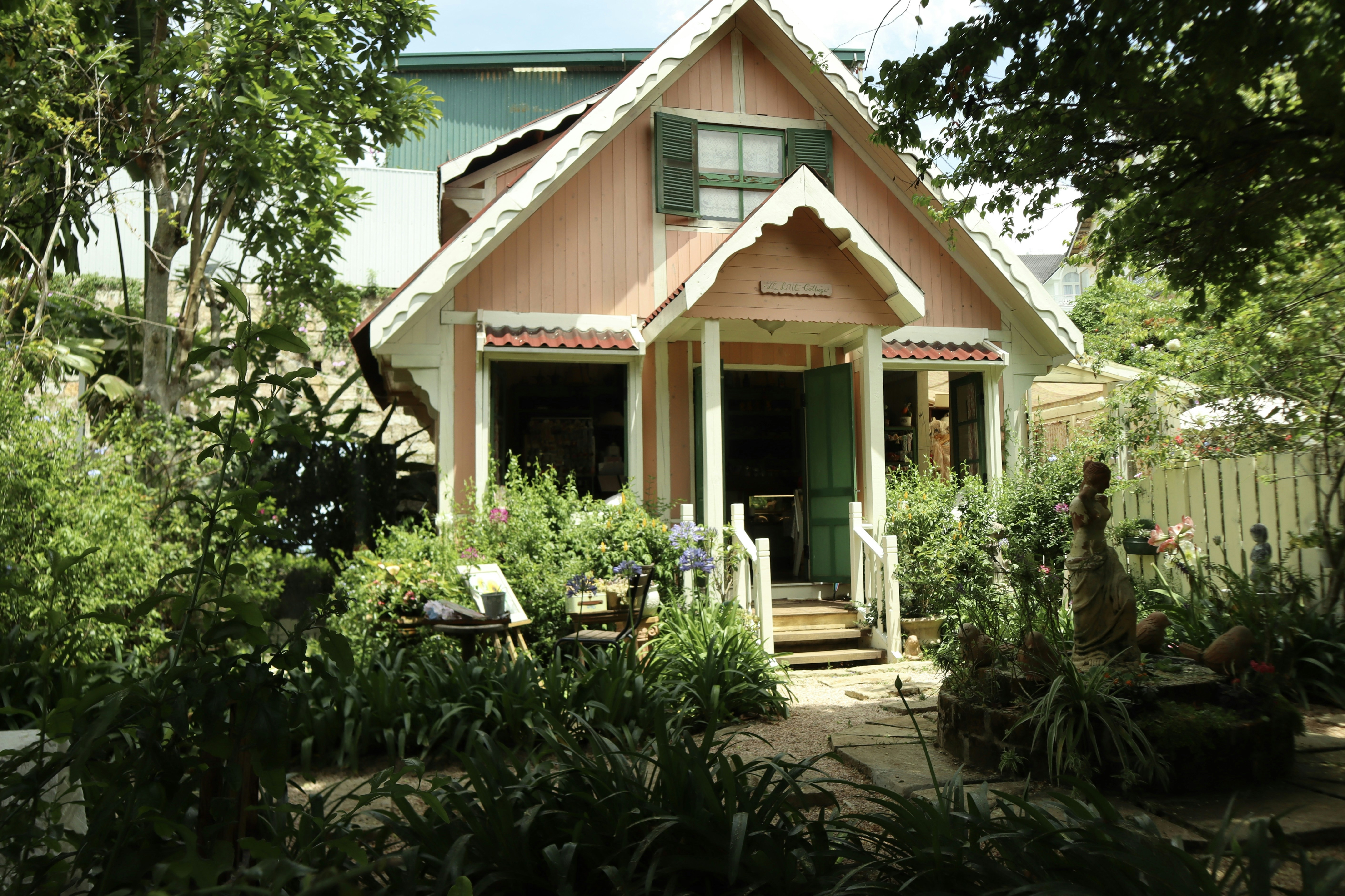 Pastel cottage in a sunlit garden