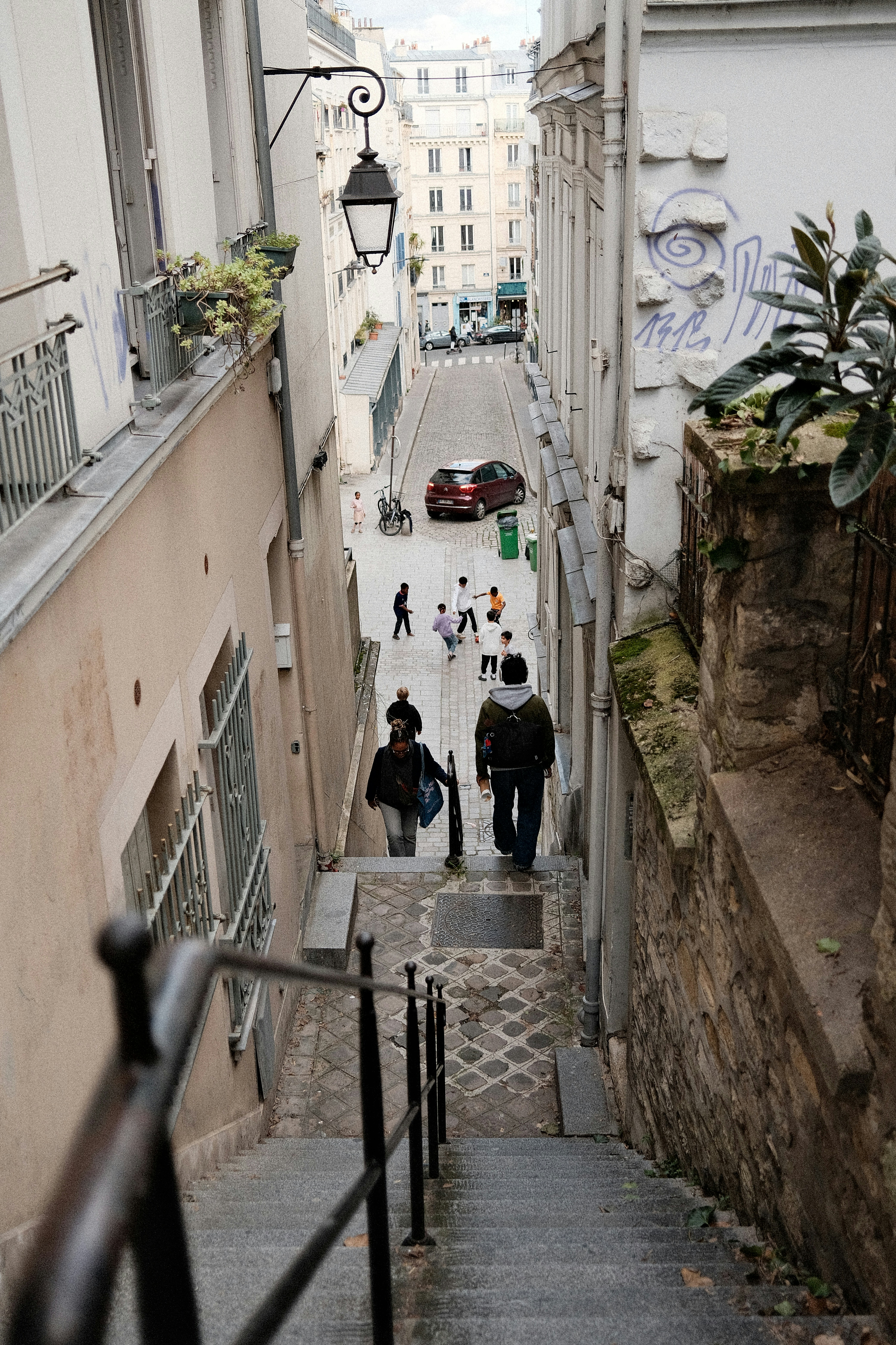 Staircase to the City: Candid descent through a Parisian Lane