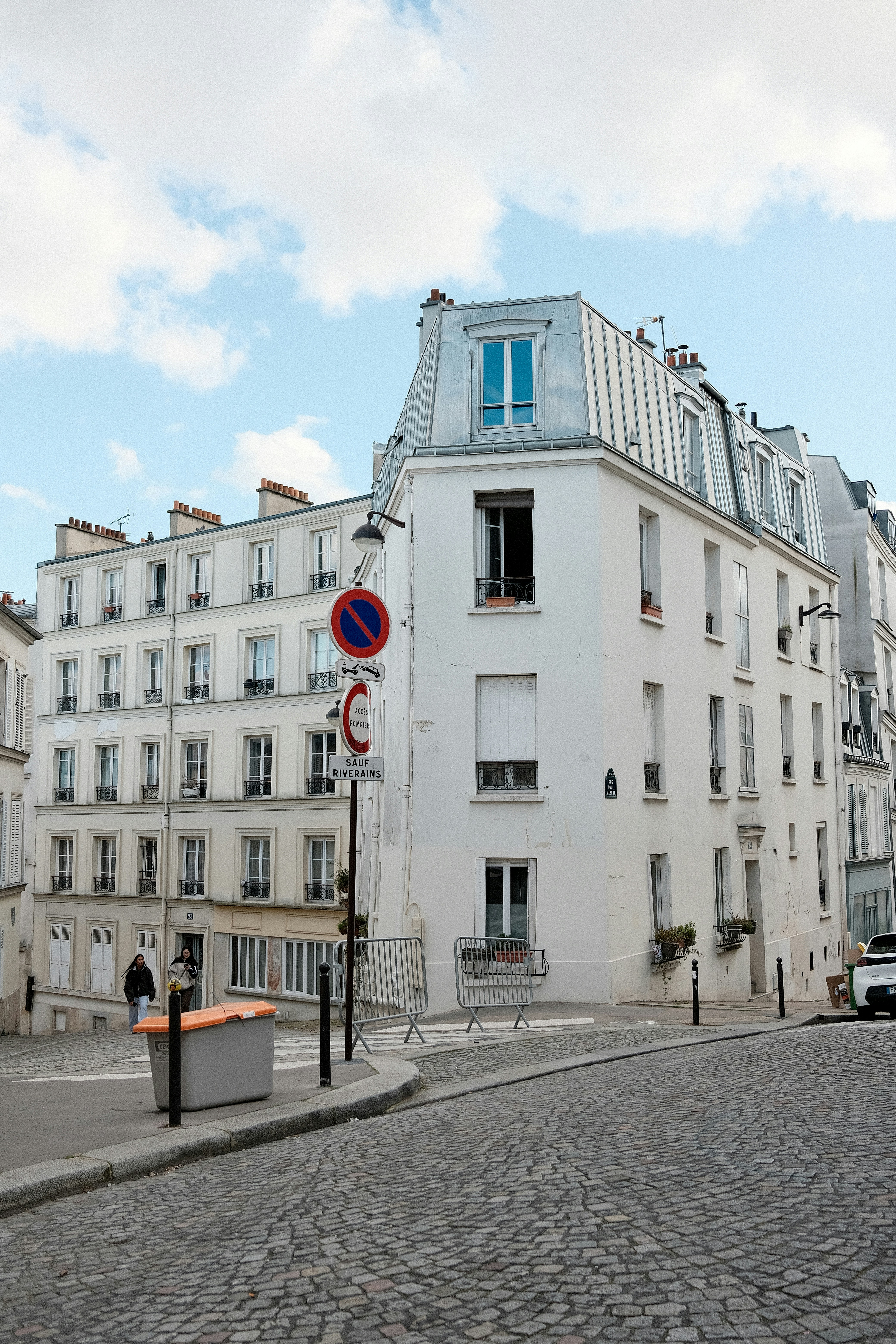 Parisian Corner: White Facades, Cobblestones, and Quiet Street Light