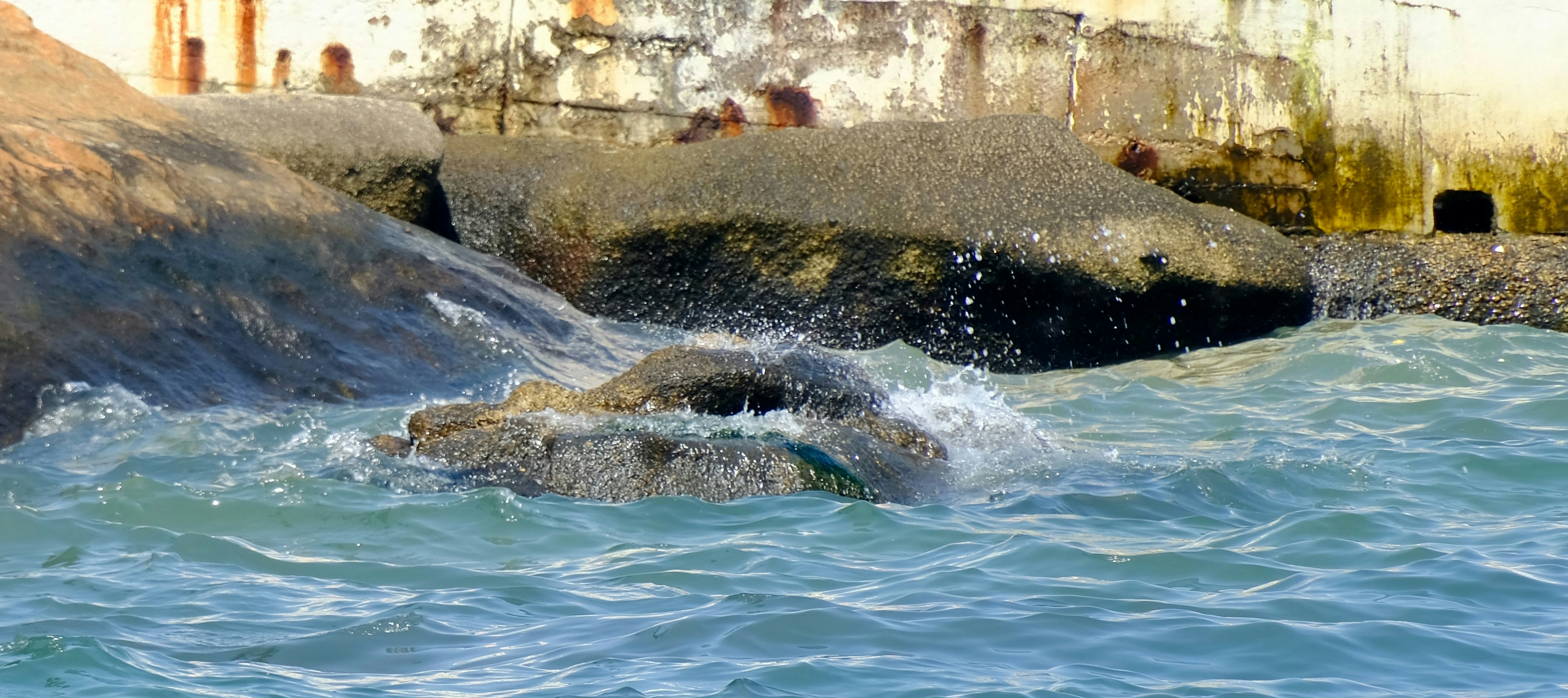 Rushing Breakers Against a Coastal Pier