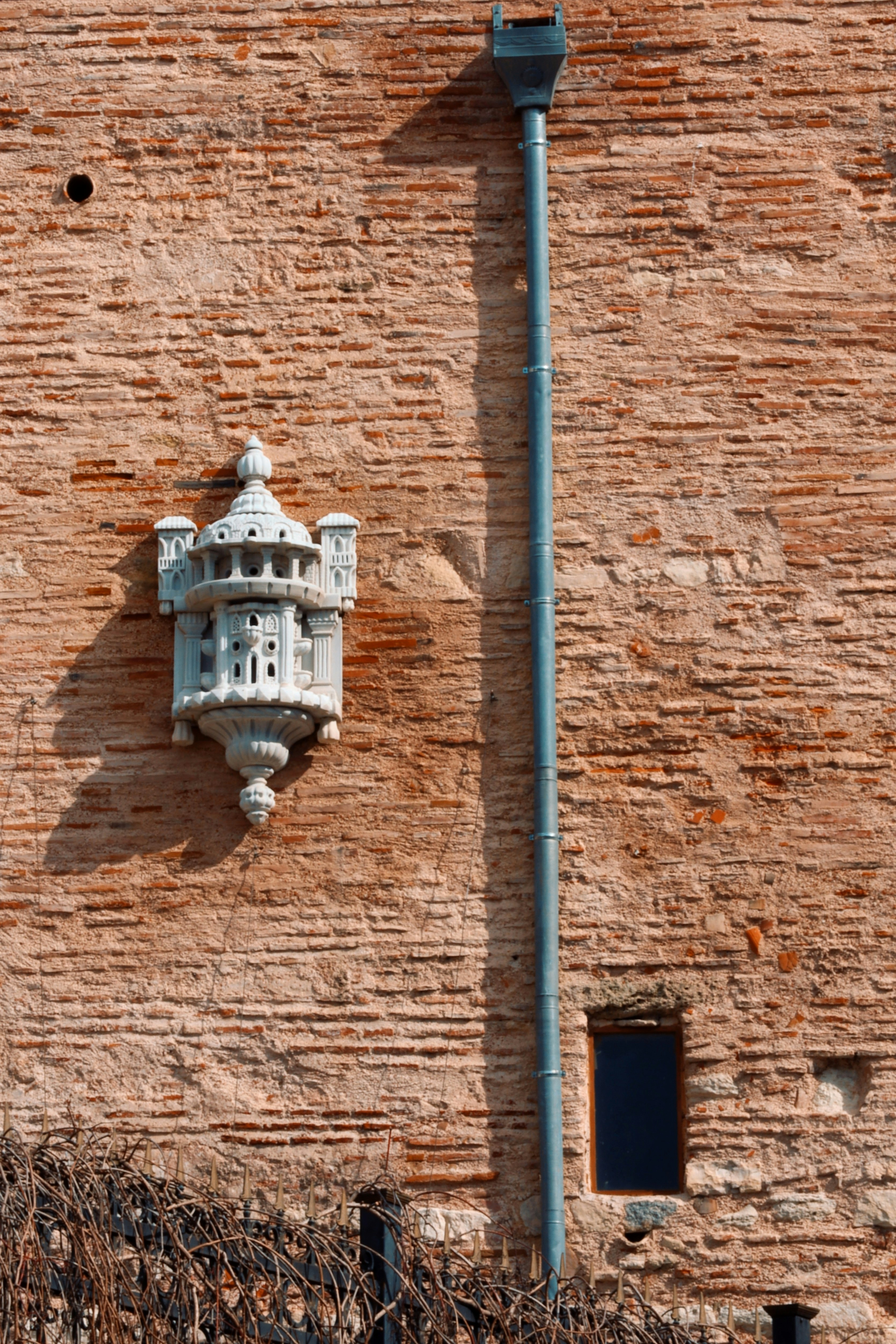 Stone Lantern on Red Brick: A Quiet Corner of Time