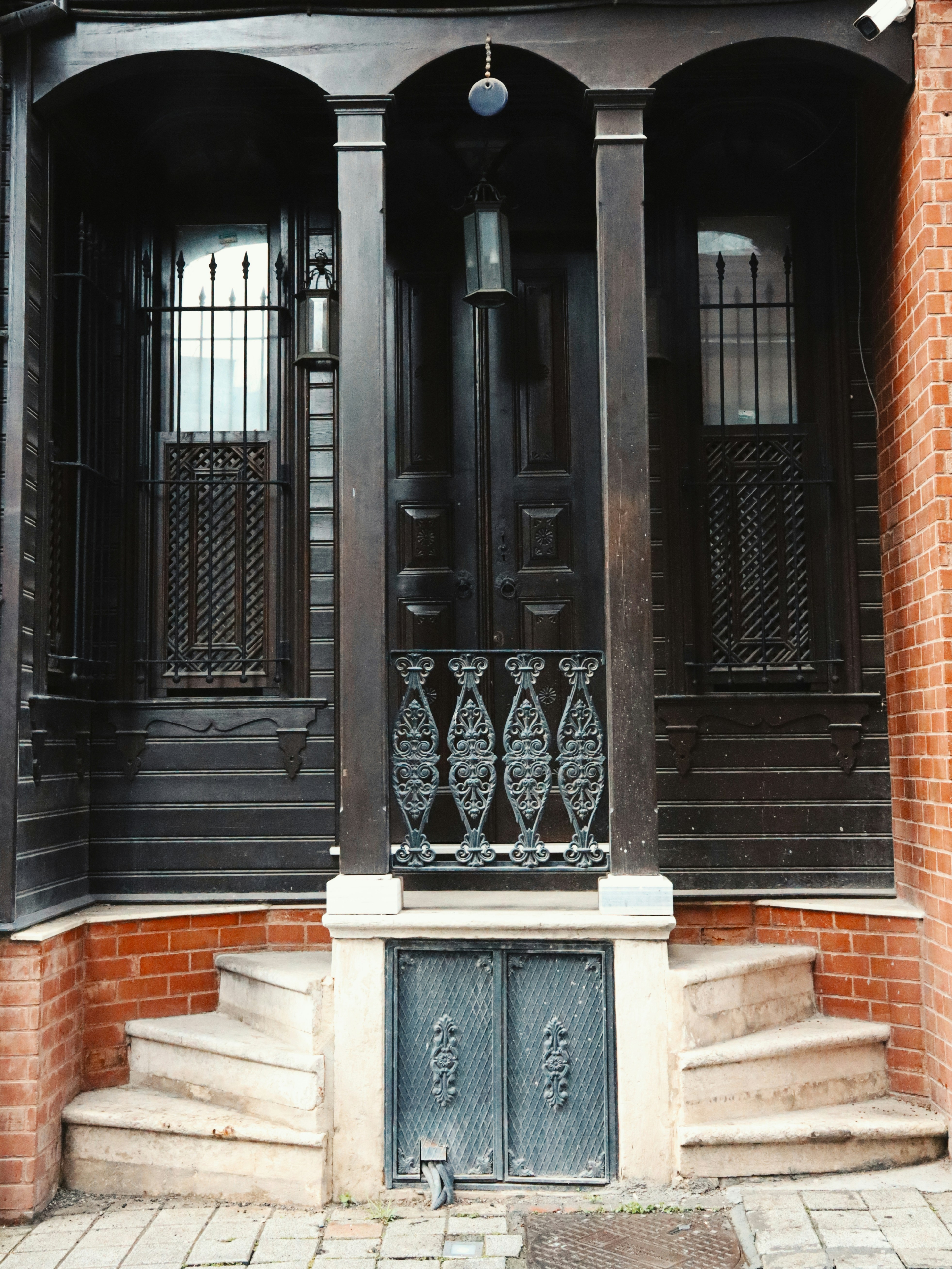 Ironwork Doorway on a Brick Stoop