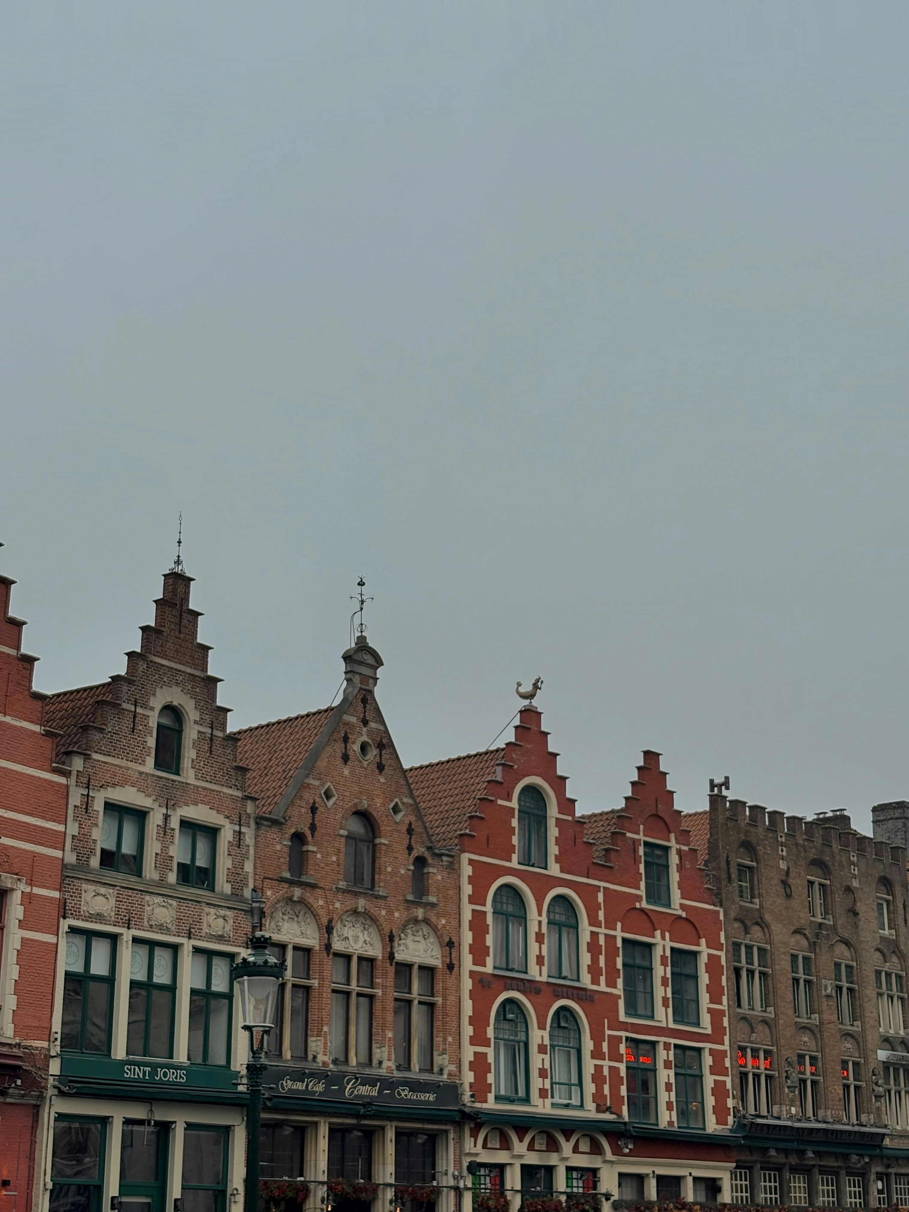 Row of Gabled Facades Beneath a Pale Sky