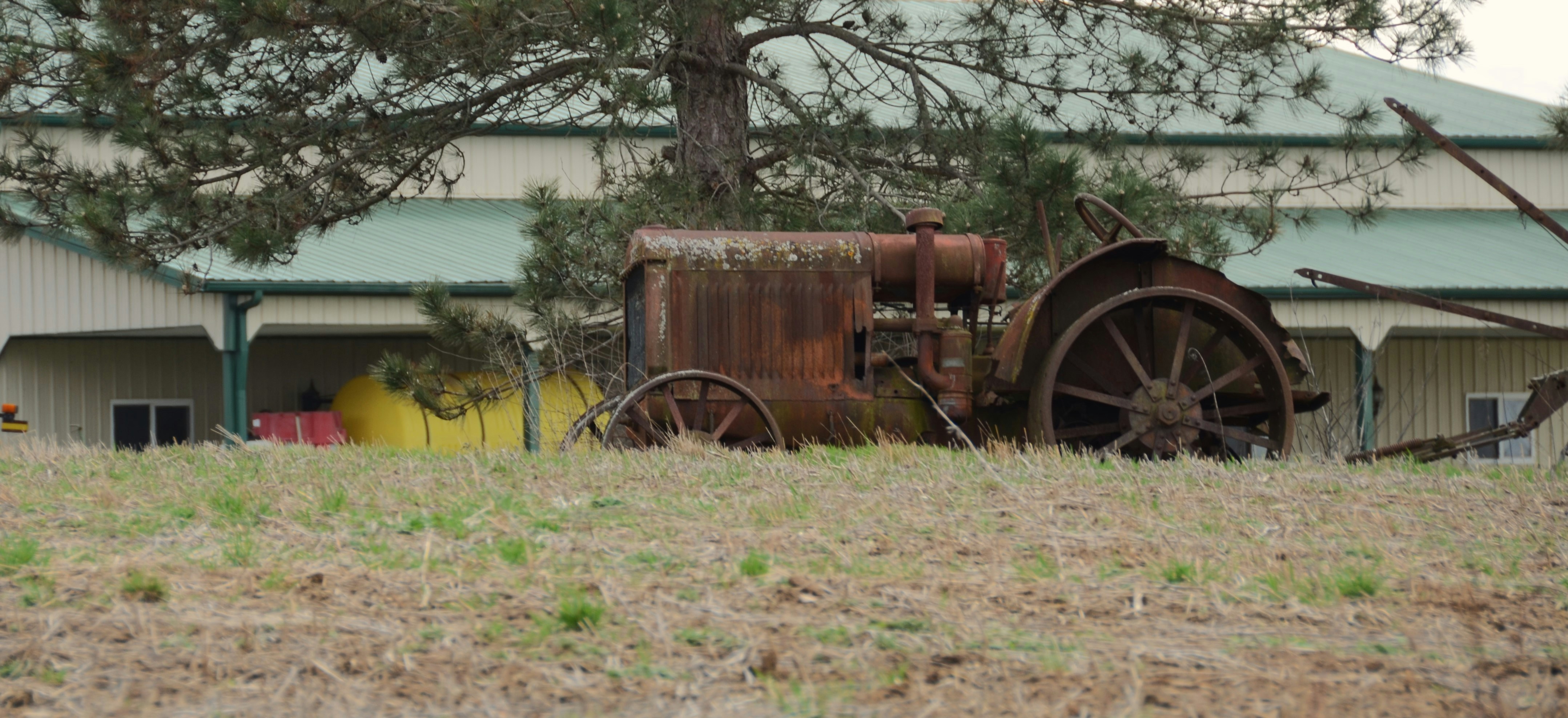 Rust in the Field: An Old Tractor Finds Its Quiet Rest