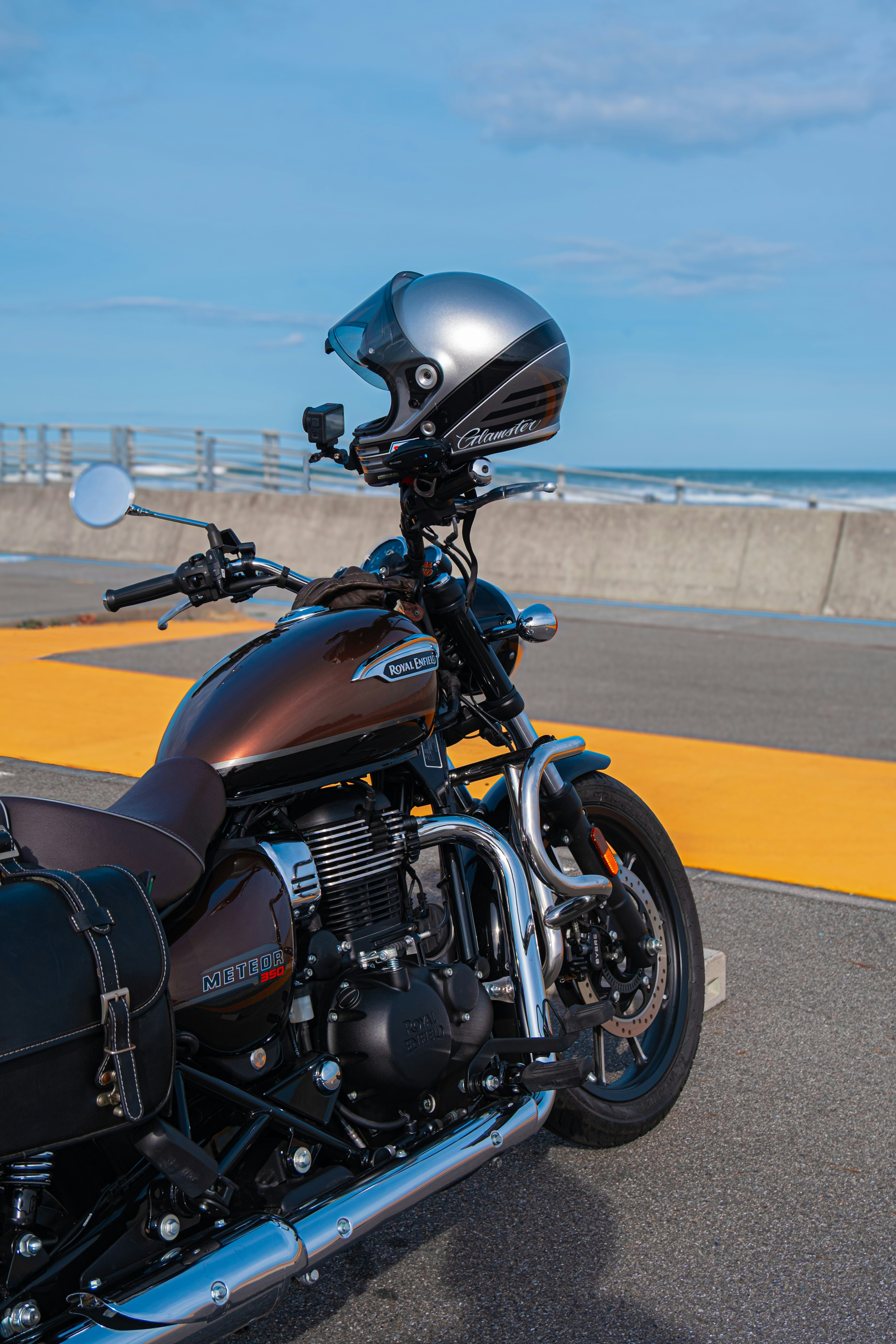 Chrome on the Coast: A Classic Motorcycle Resting by the Seawall