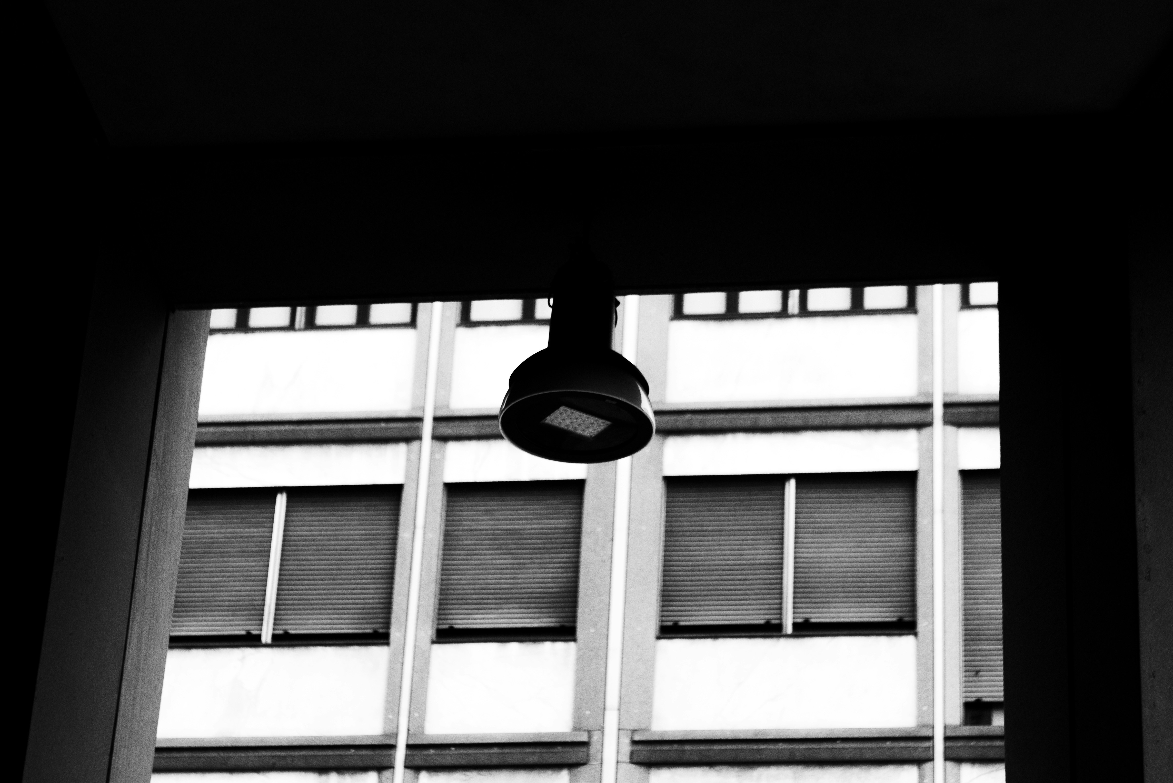 Pendant Light Framing a Modern Facade