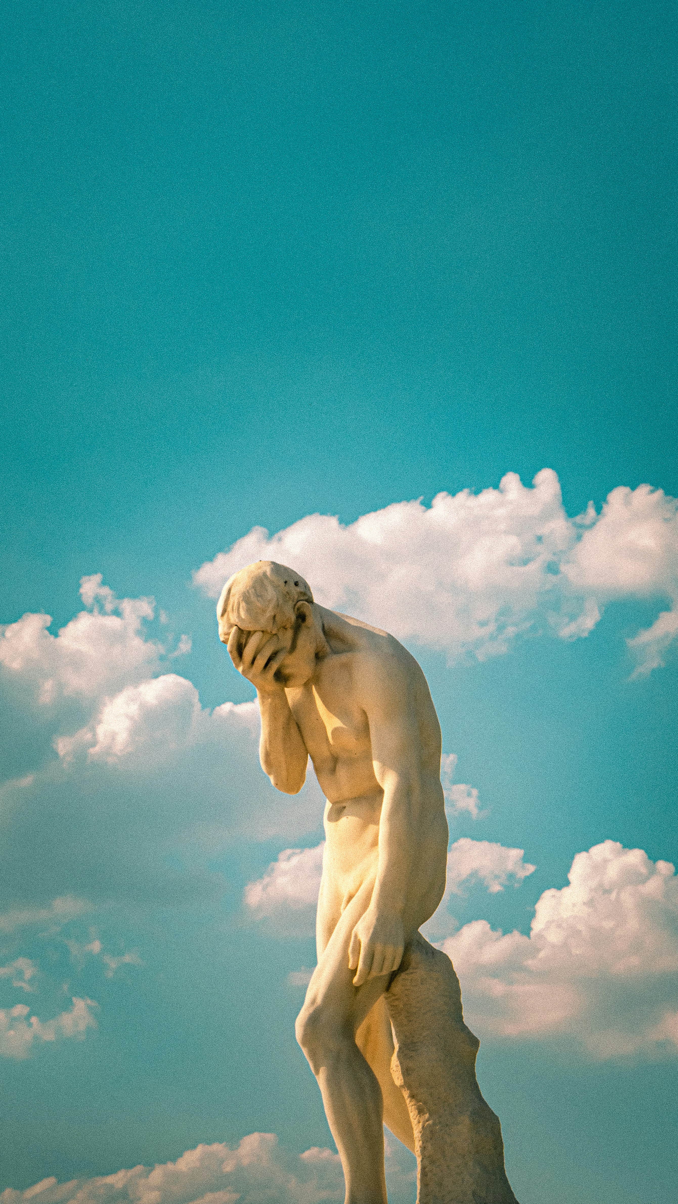 Contemplation in Marble: A Statue Reaches Toward the Sky
