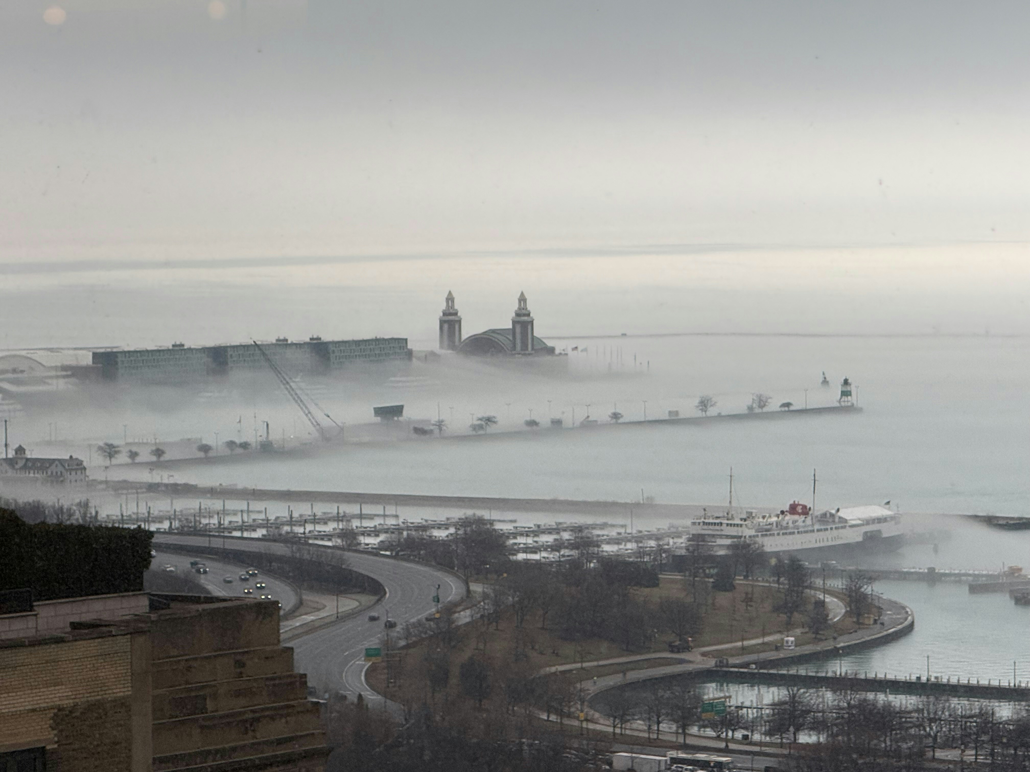 Misty Coastal Drive Toward the Pier