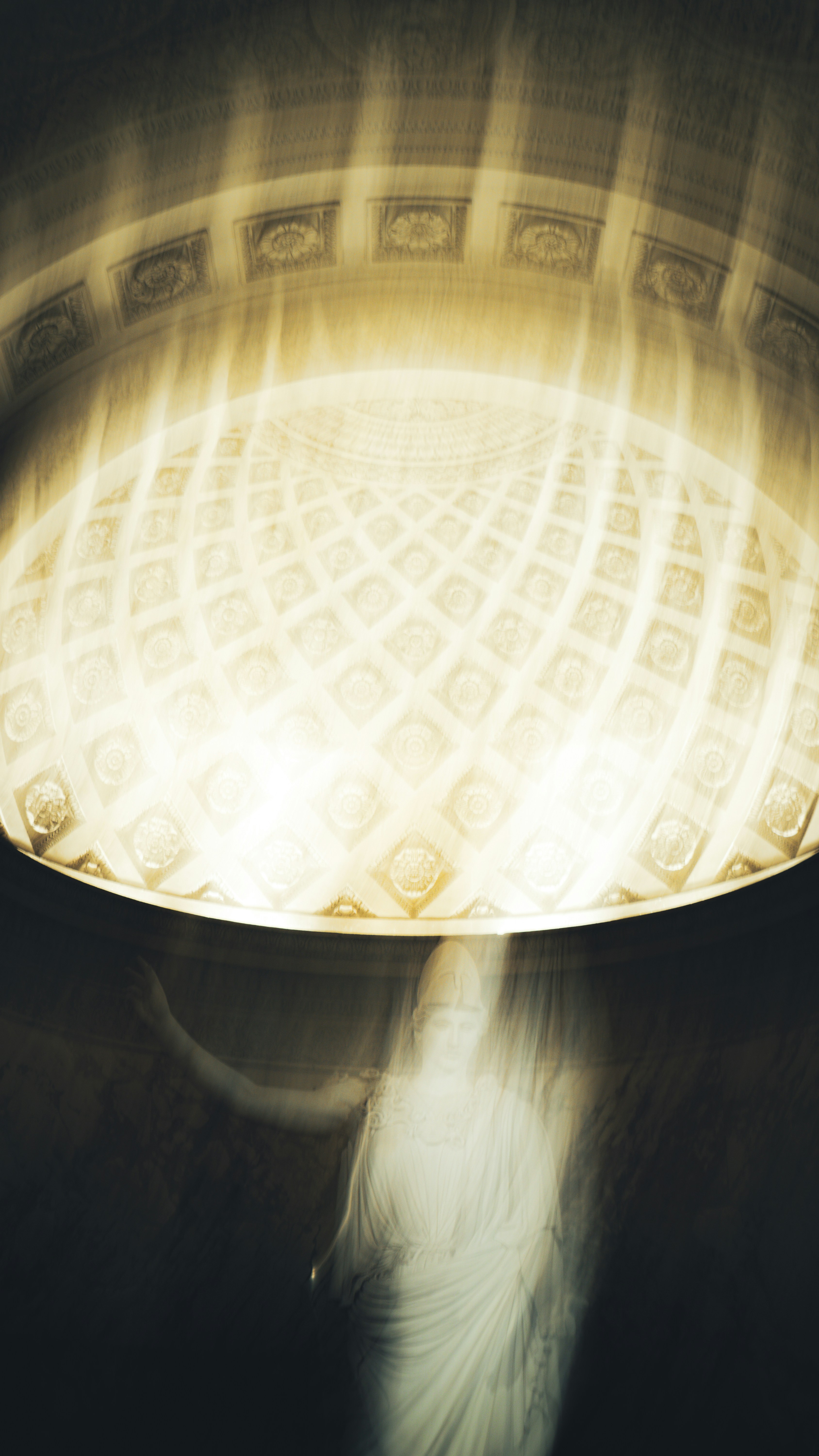 Halo of Light: A Vaulted Spotlight and Ghostly Figure