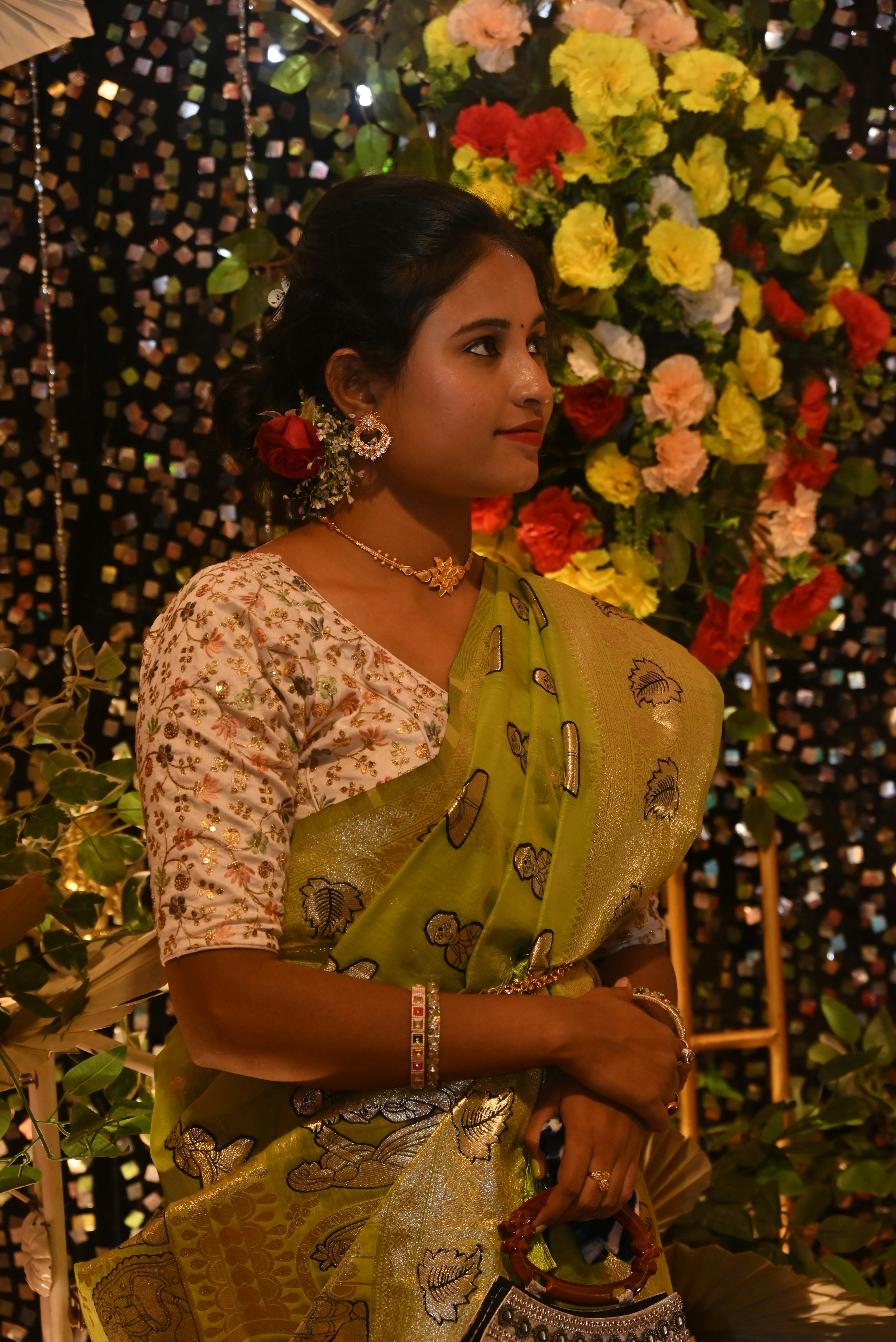 Sunlit Grace: A Traditional Attire Portrait Amid Floral Cascade