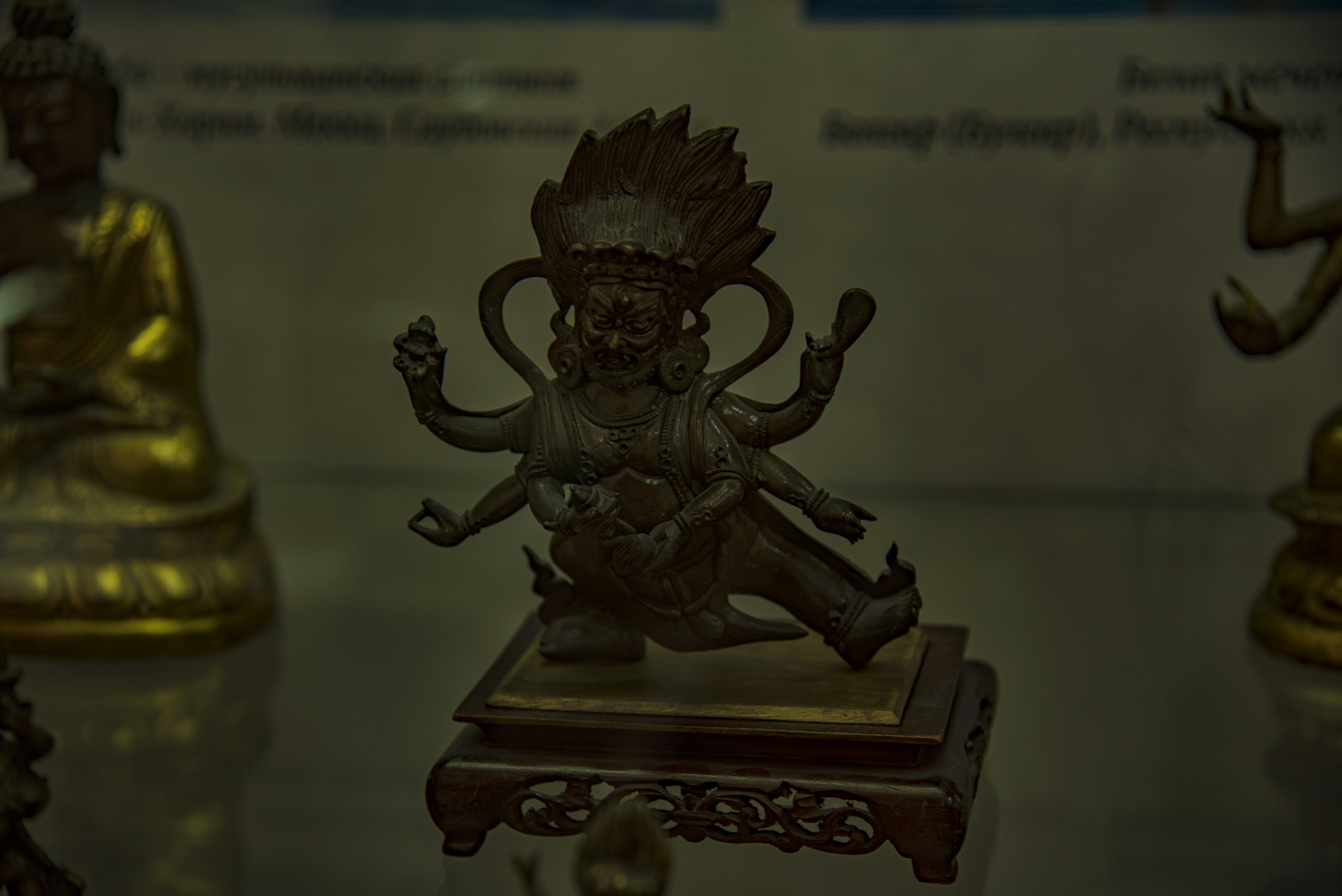 Dimmed Guardian: A Closer Look at the Central Deity