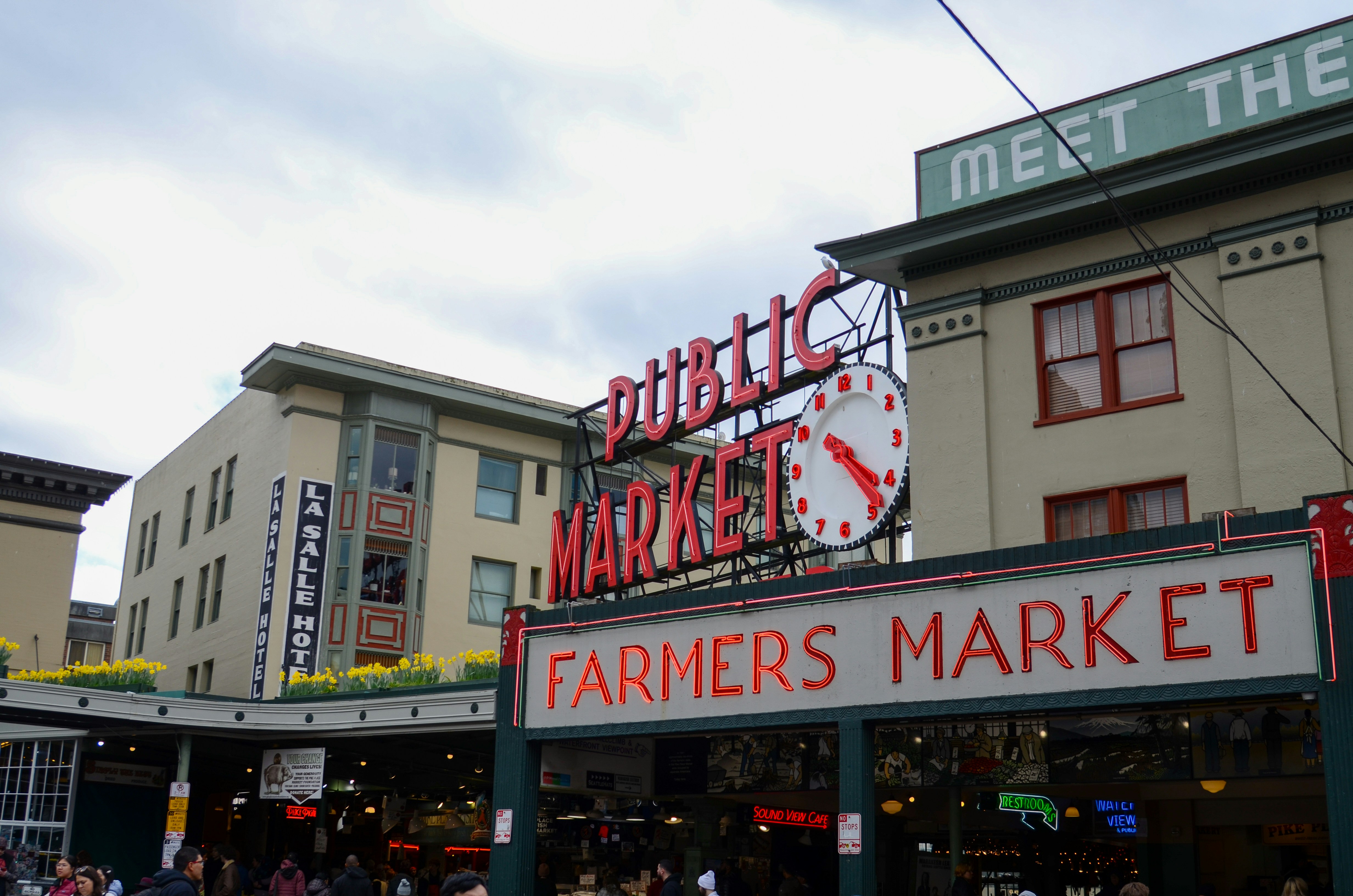 Neon Signage and Clock Over the Public Market Entrance