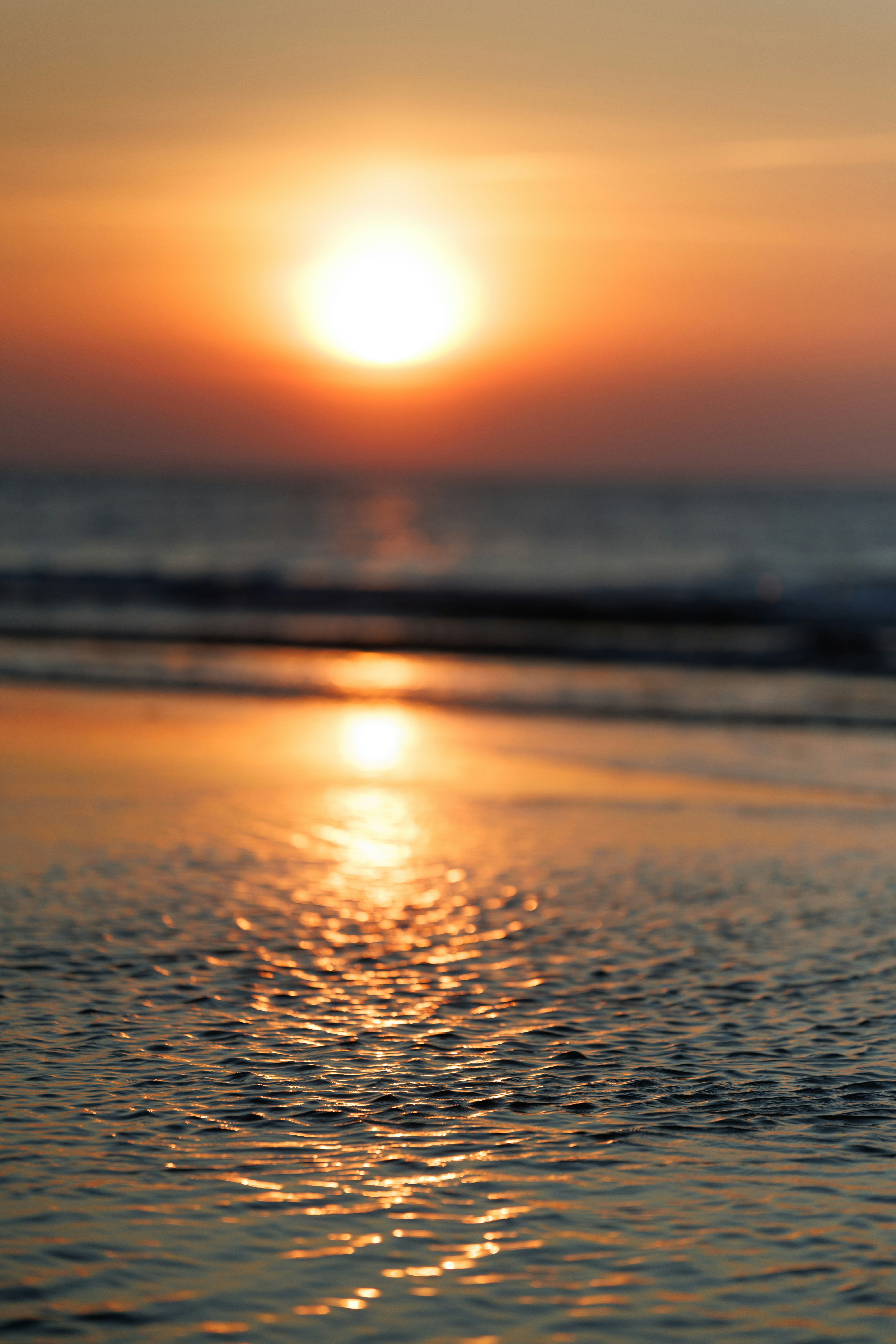Glass Horizon: Sunset over a Quiet Tide