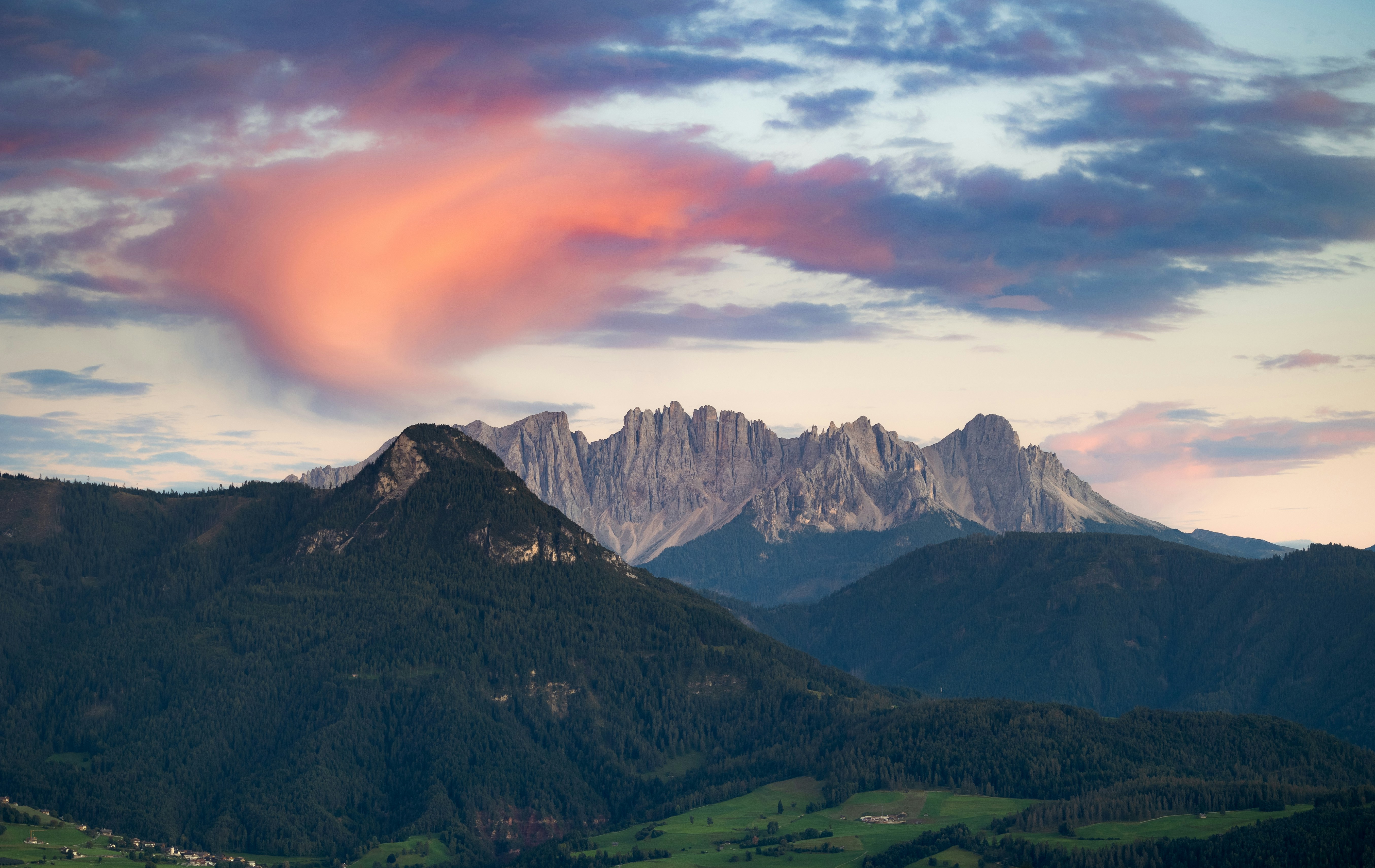 Mountain range with dramatic clouds at sunset