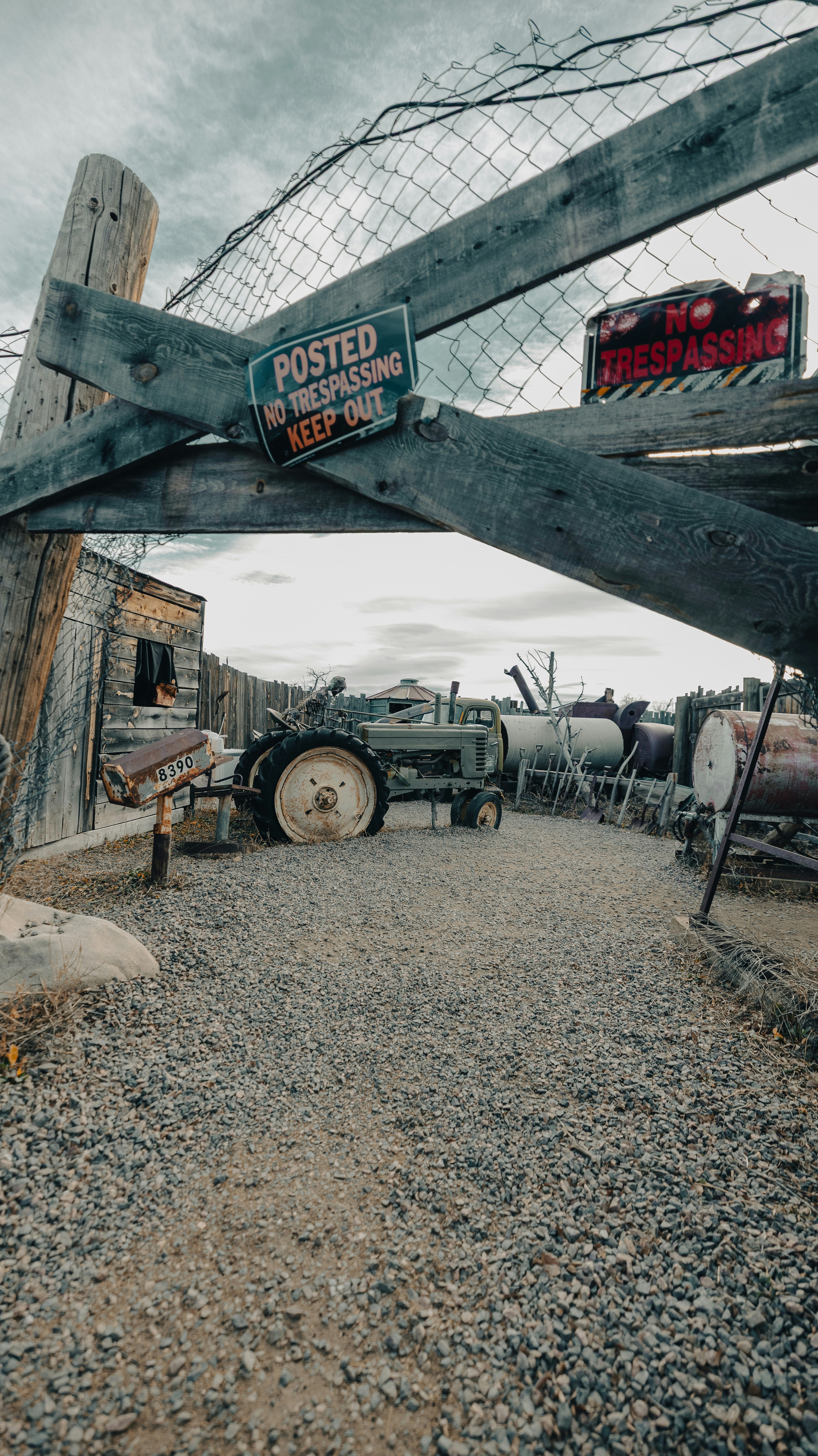 Forbidden Entry: Weathered Yard Behind the Fence