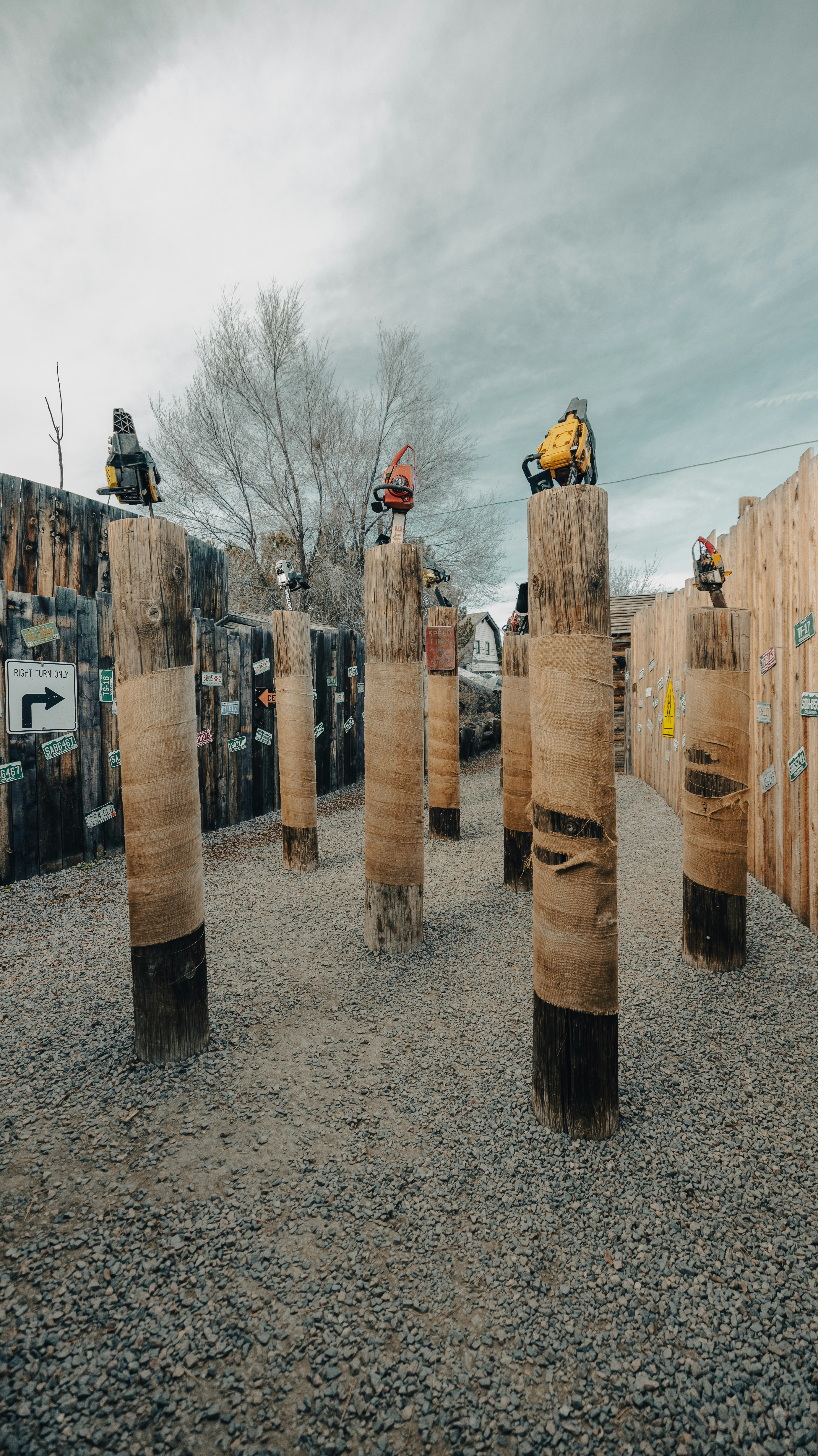Pole-lined Alley of Weathered Timbers Under a Quiet Sky