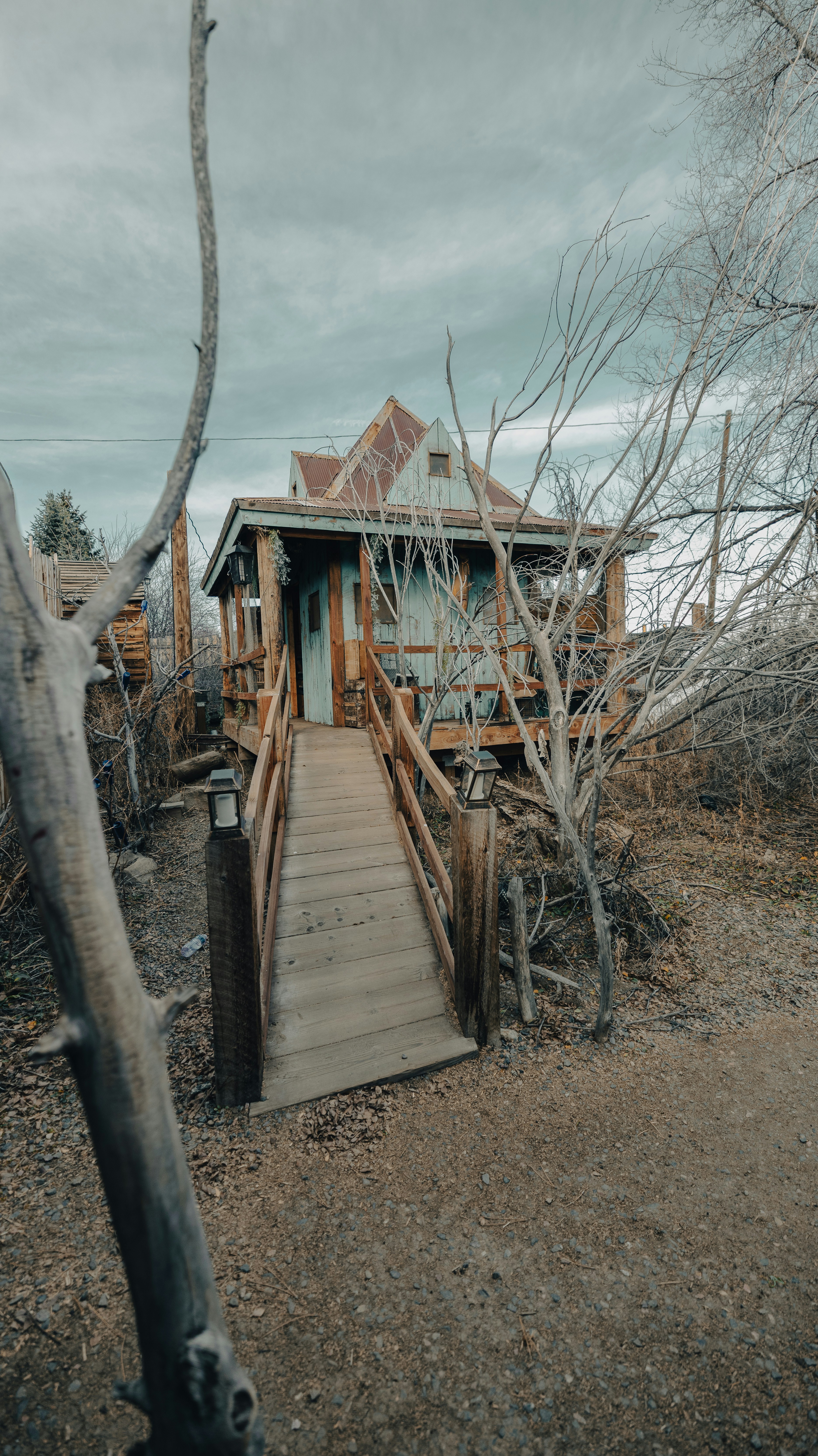 Wooden Cottage Reach: A Quiet Path to a Painted Gatehouse