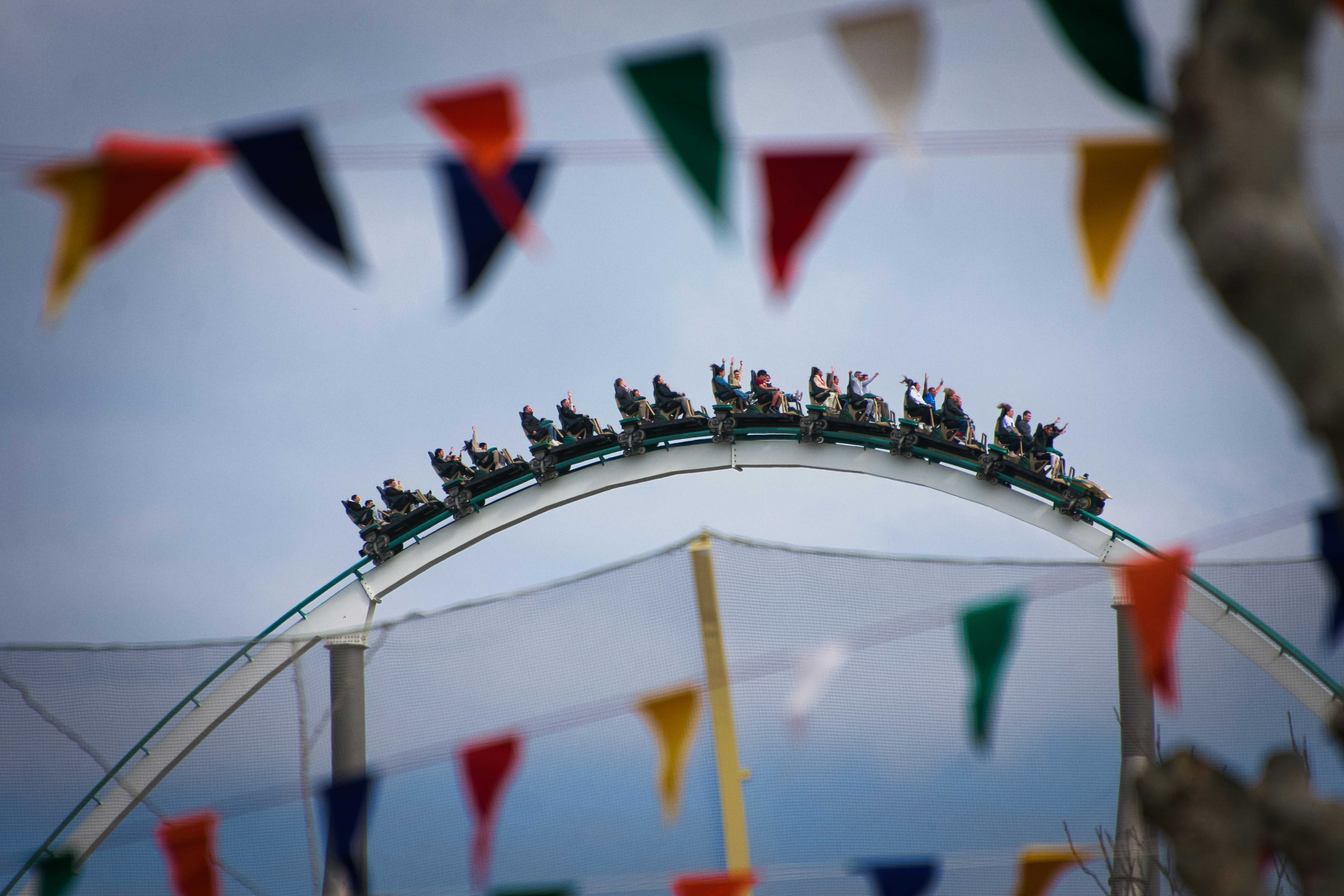 Arc of Thrill: Riders Crest the Loop in a Tangle of Color