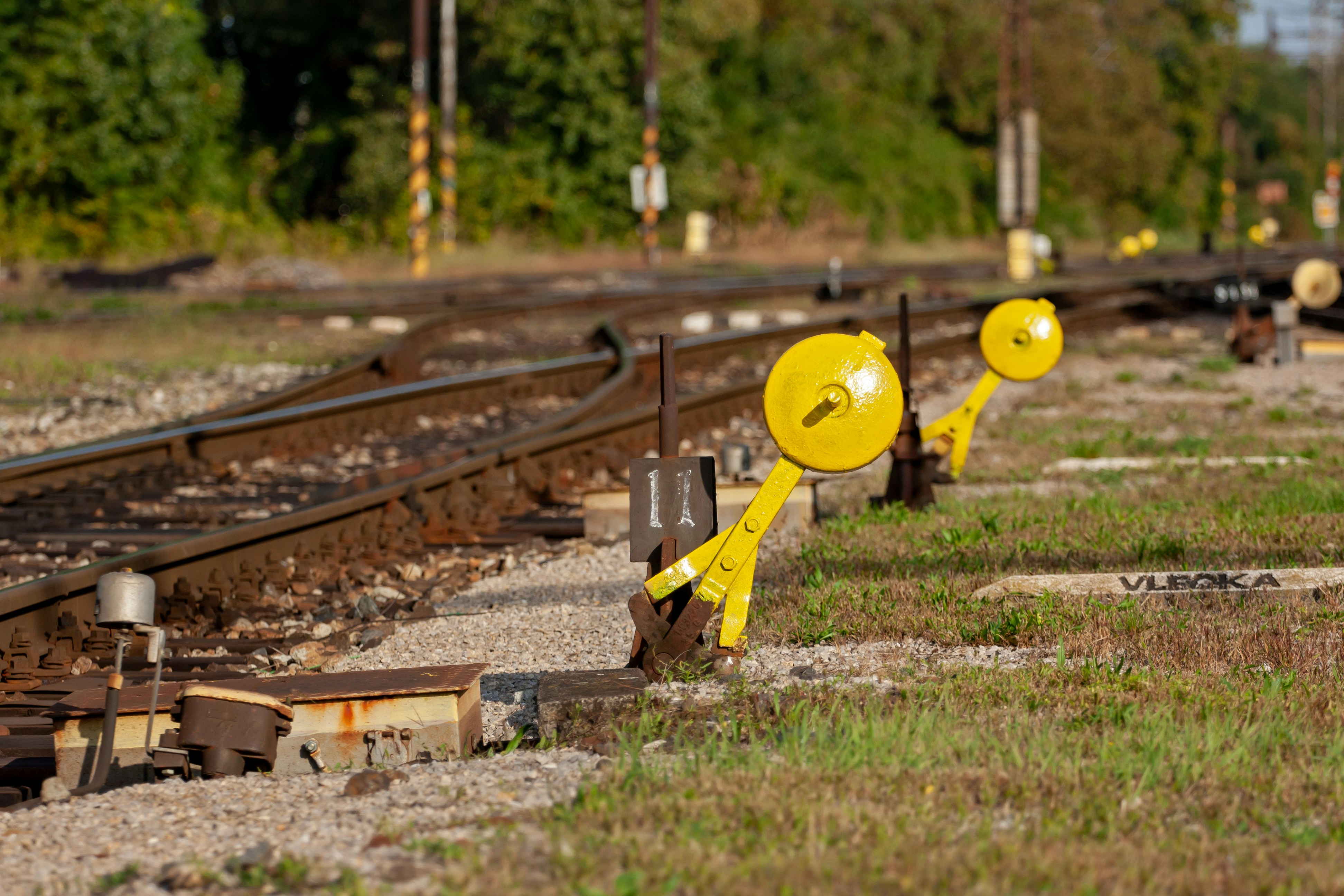 Yellow railway signals in a quiet yard