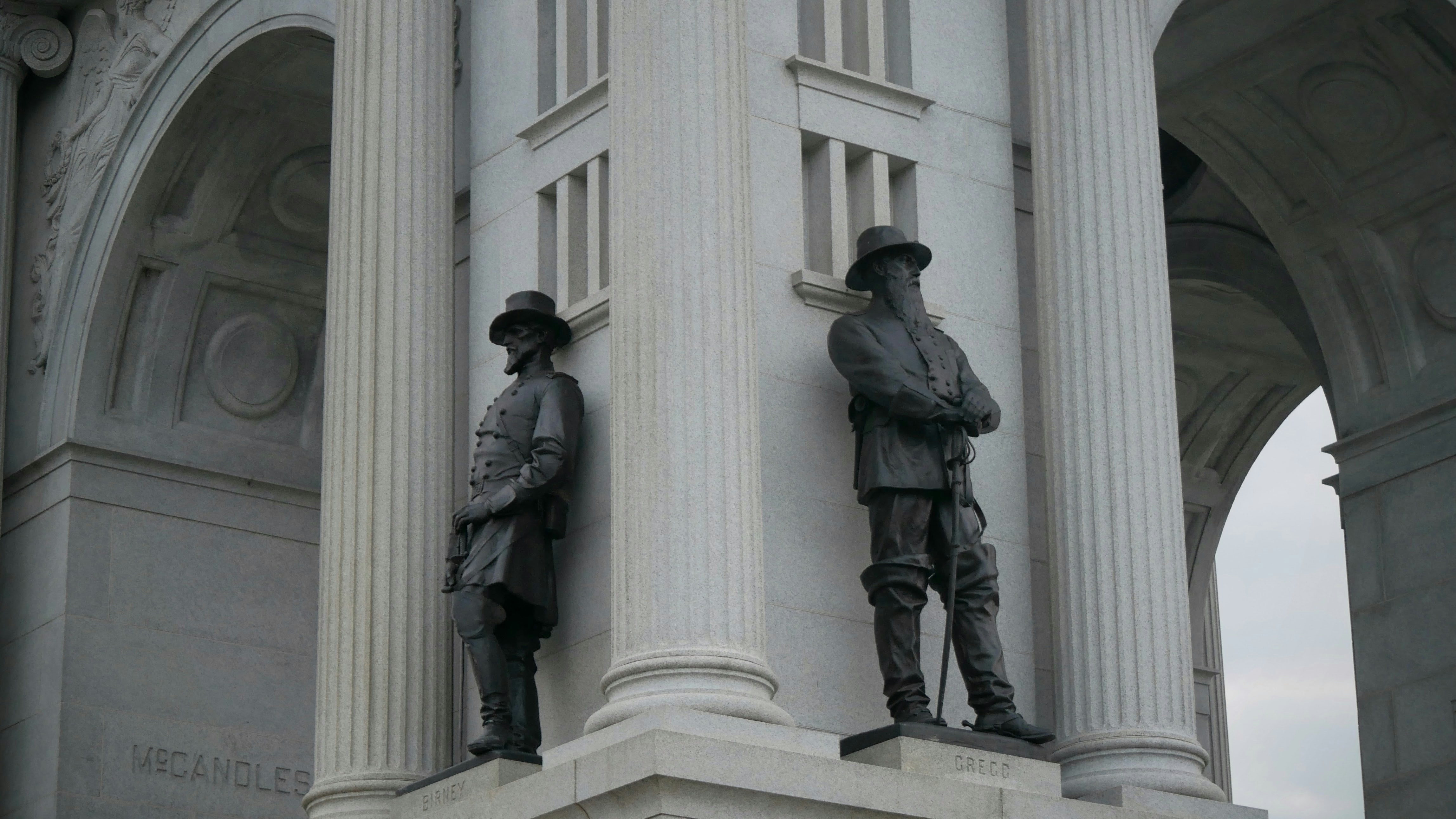 Guardians on Marble Pillars: A Quiet Monumental Portrait