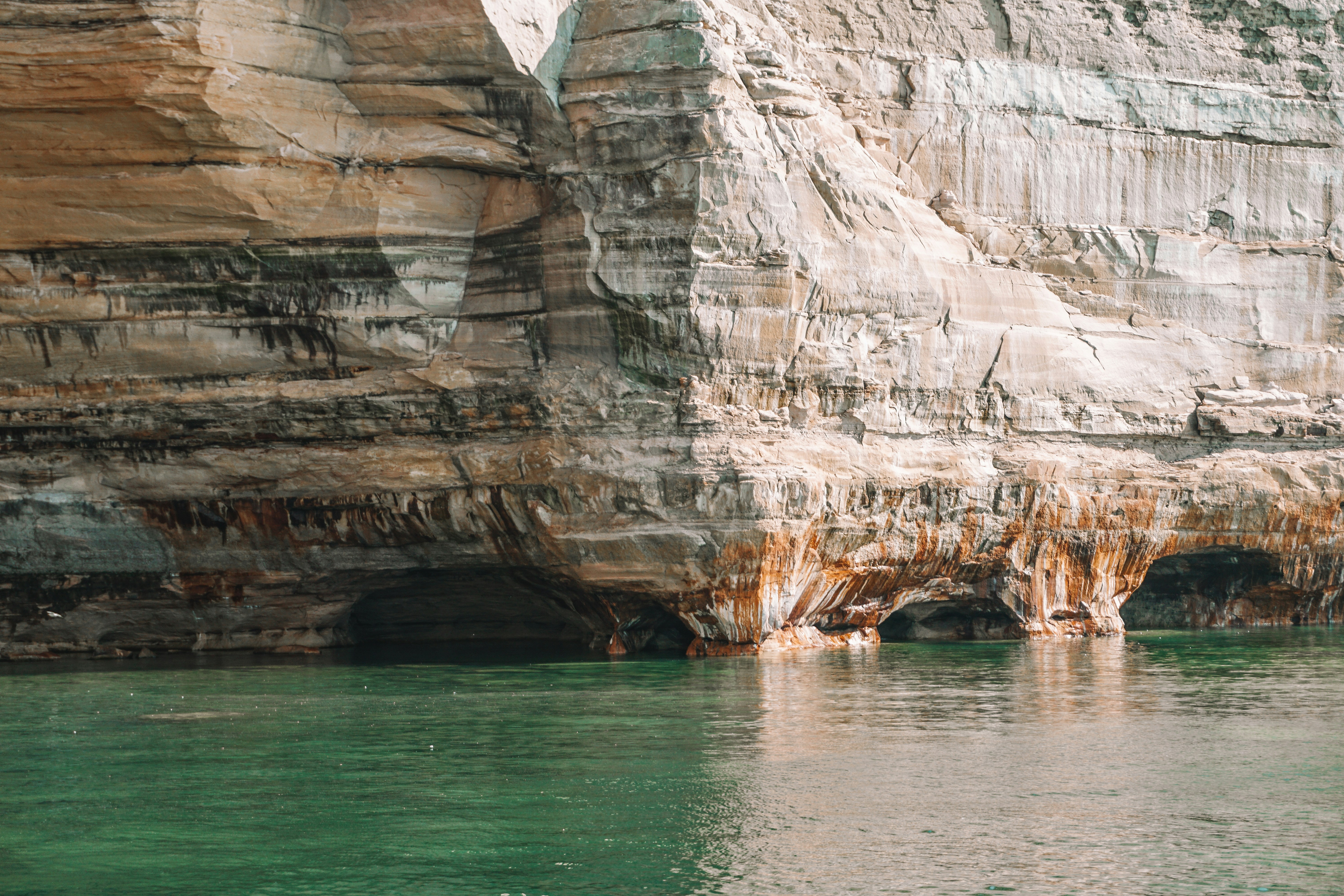 Emerald Waters Against Limestone Cliffs