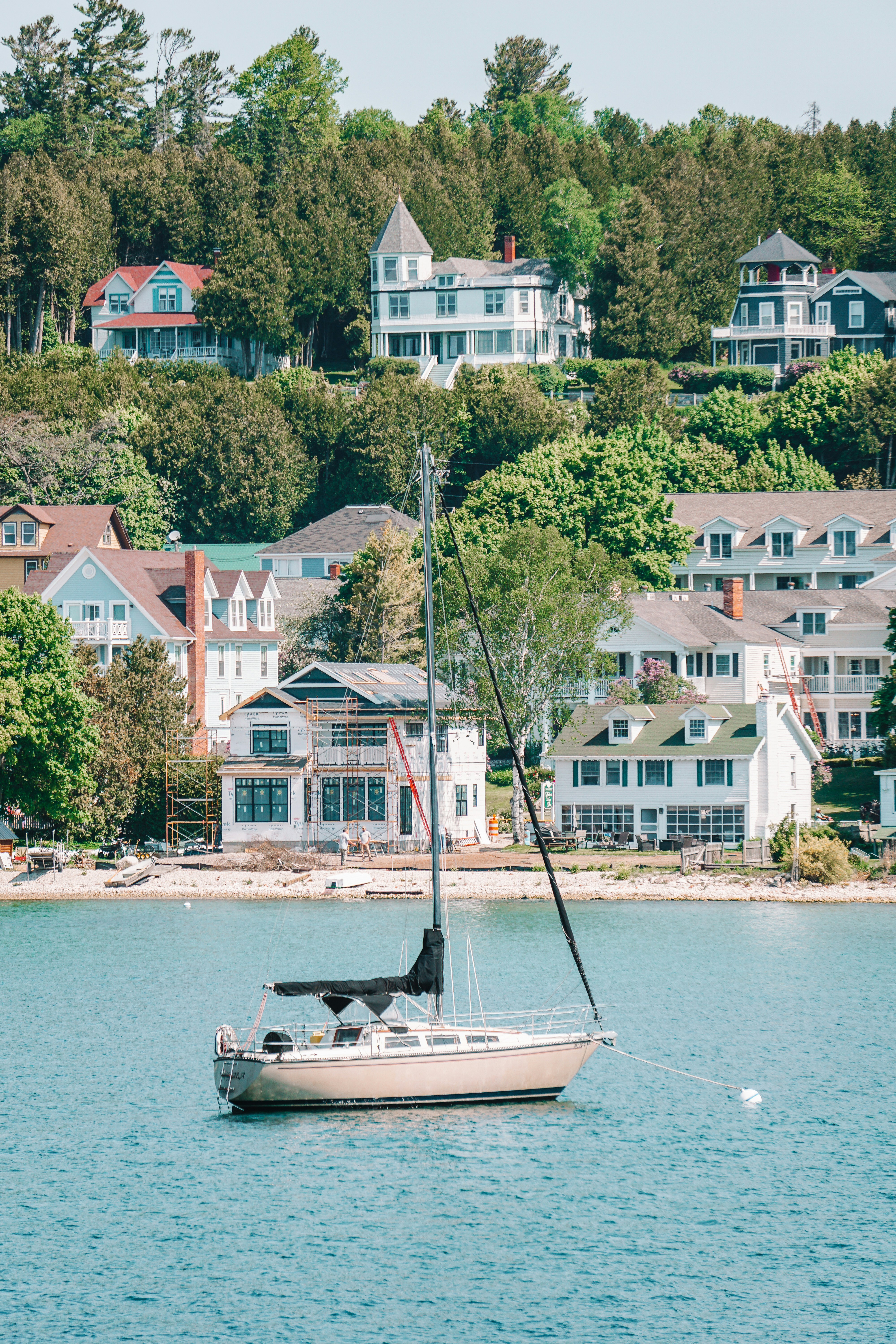 Sailboat Quietly Draped Across a Lakefront Village