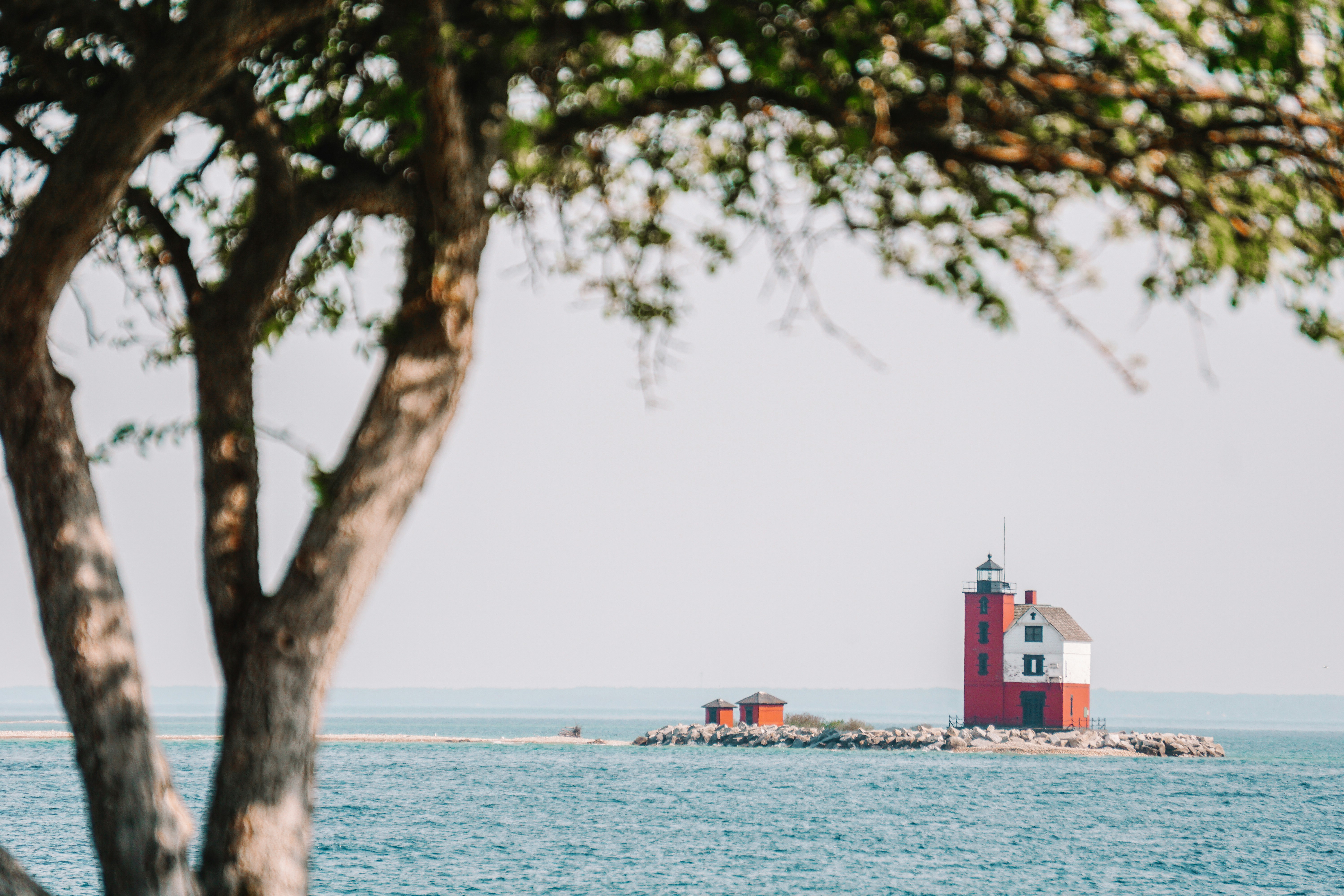 Lighthouse Vision Across Quiet Waters