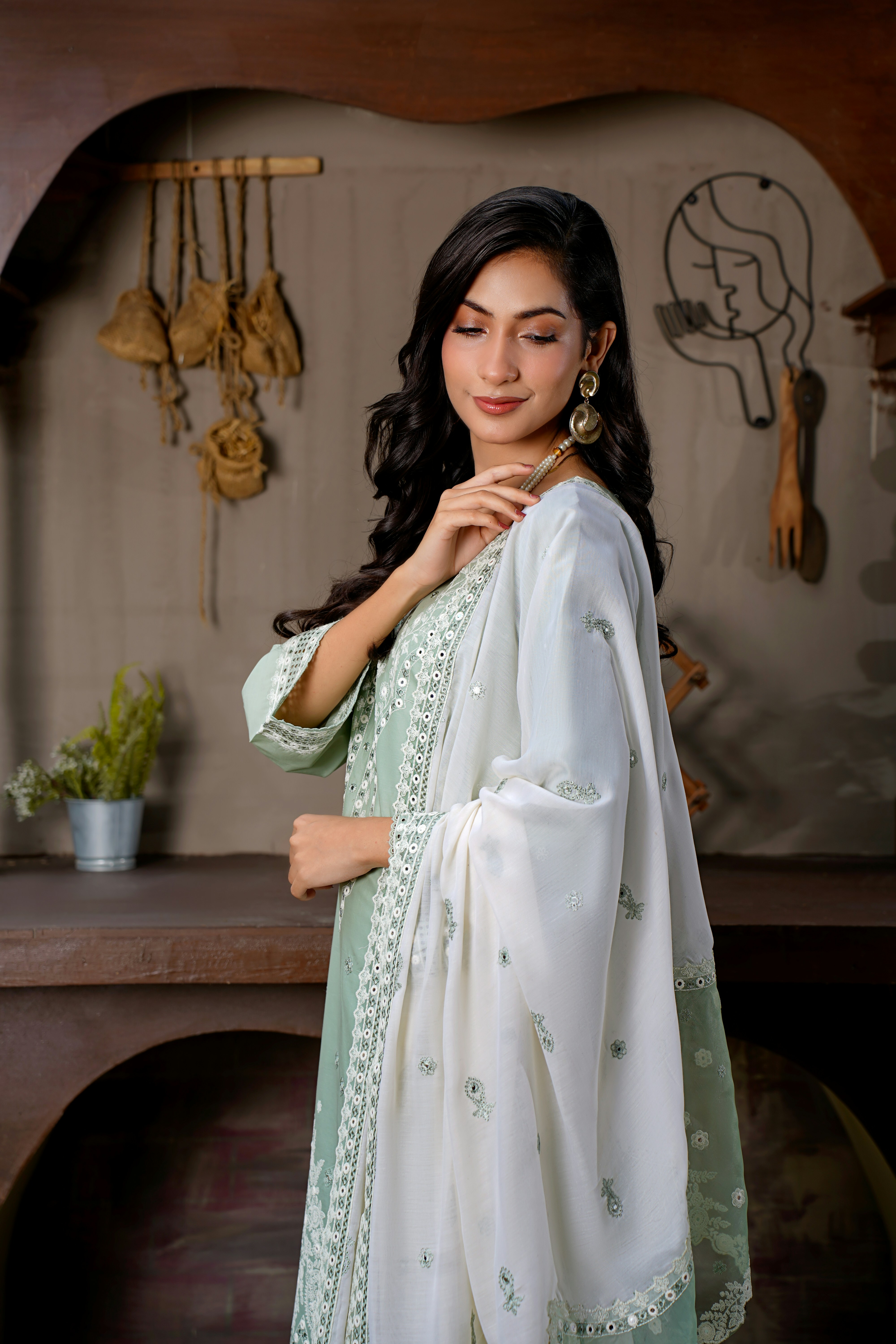 Grace in Silk: A Poised Portrait in Soft Mint
