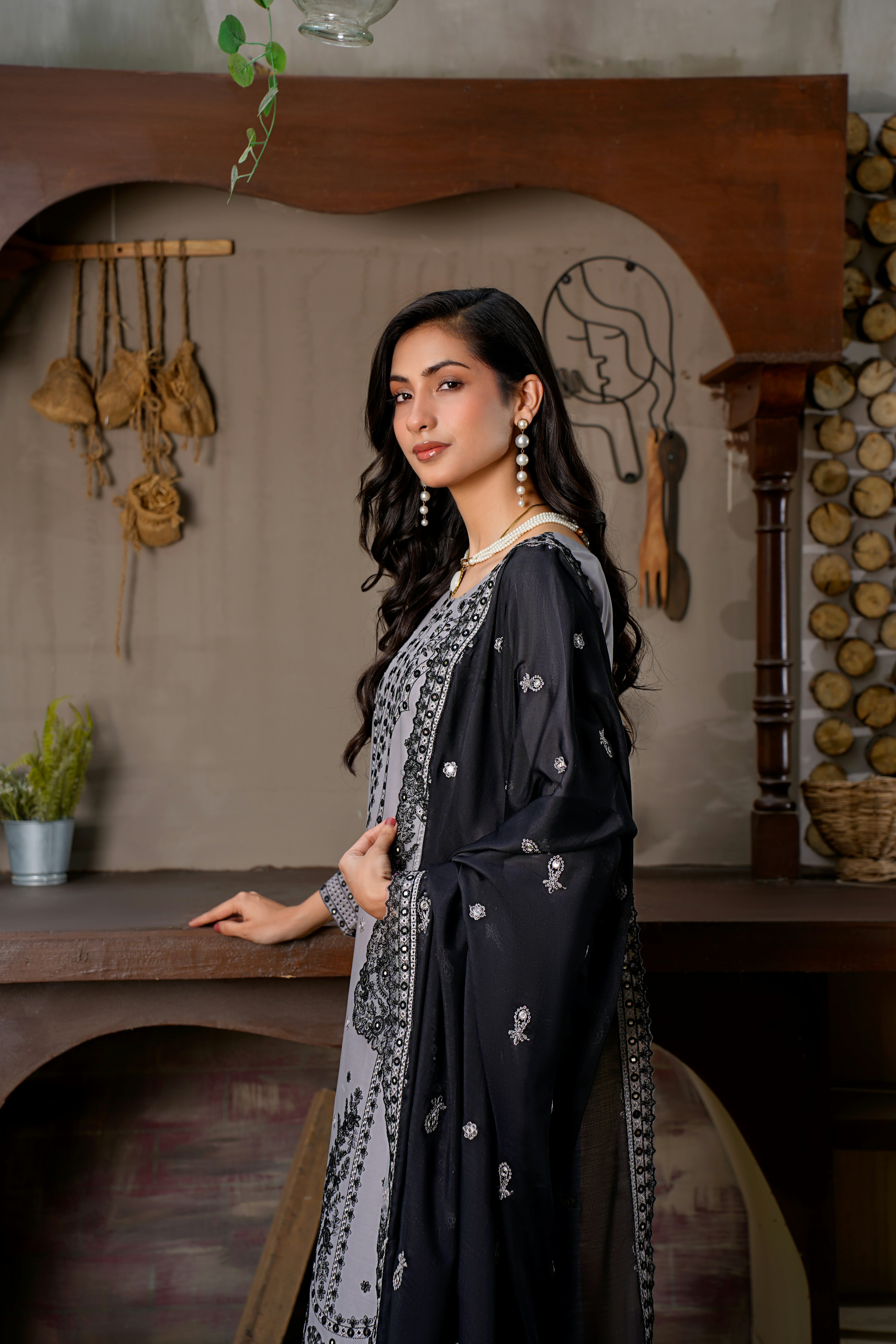 Grace in Embroidered Drapes: Portrait at a Rustic Console