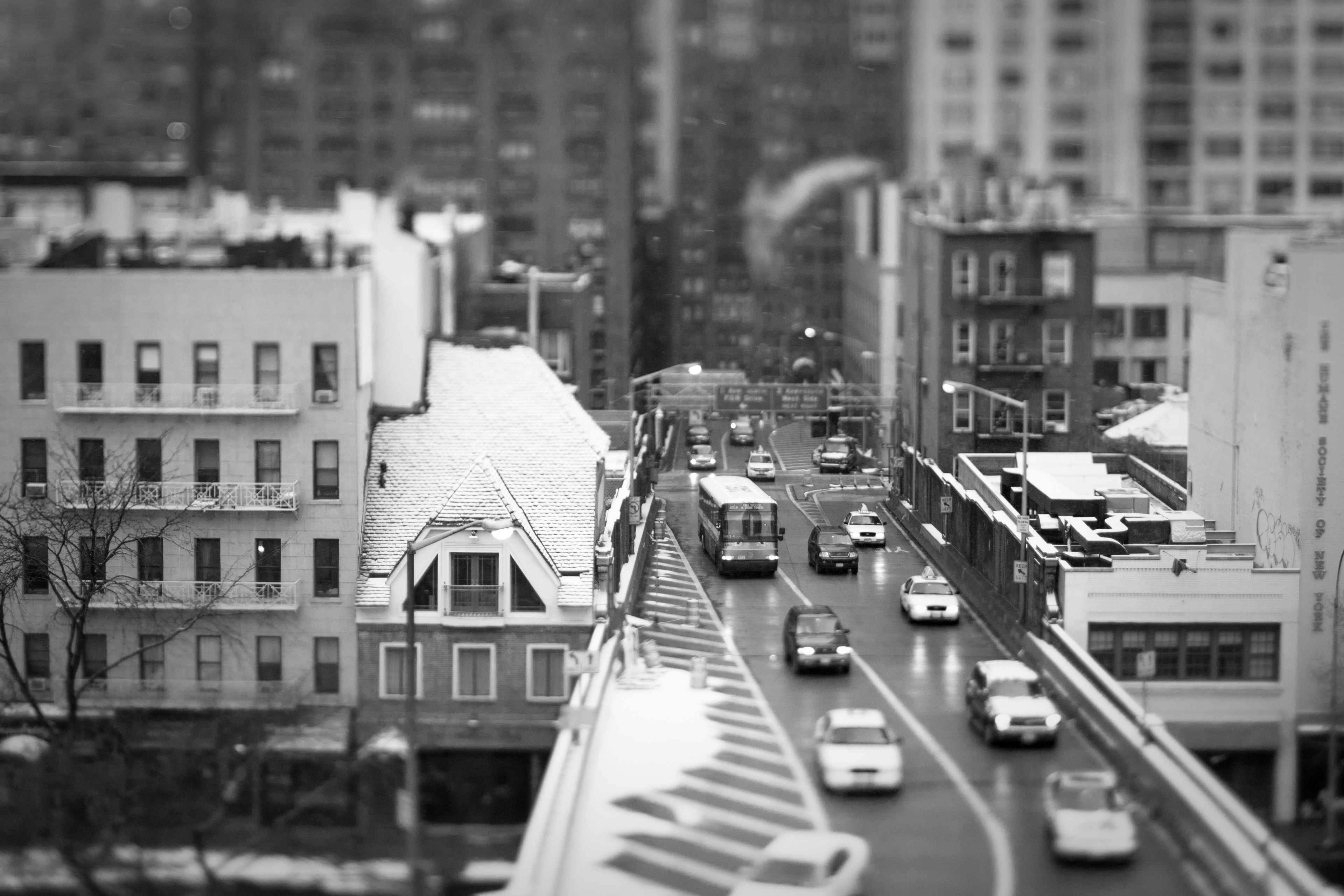 Urban Highway Through a Snow-Capped Valley of Buildings