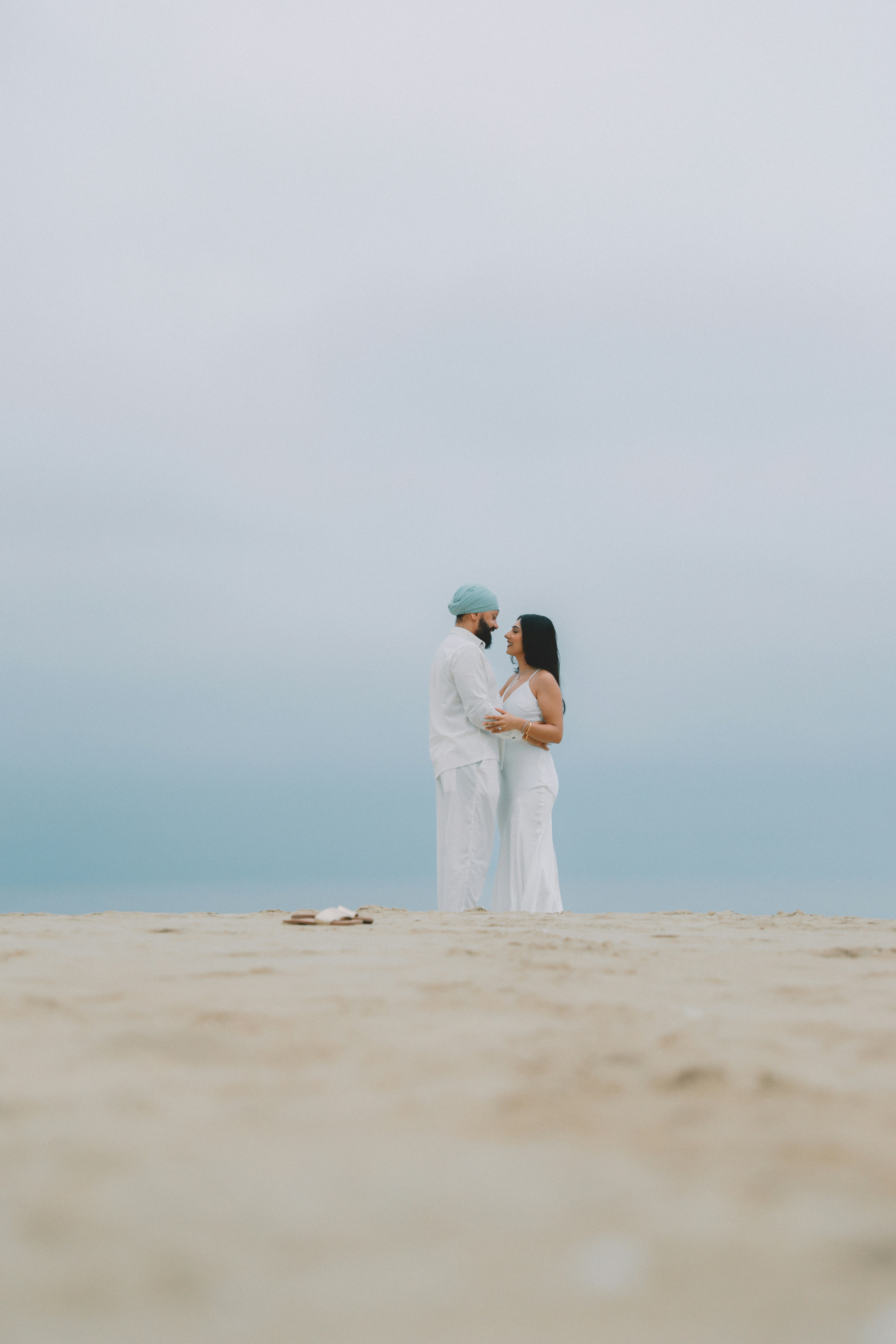 Whispers on the Shore: A Quiet Moment Between Two