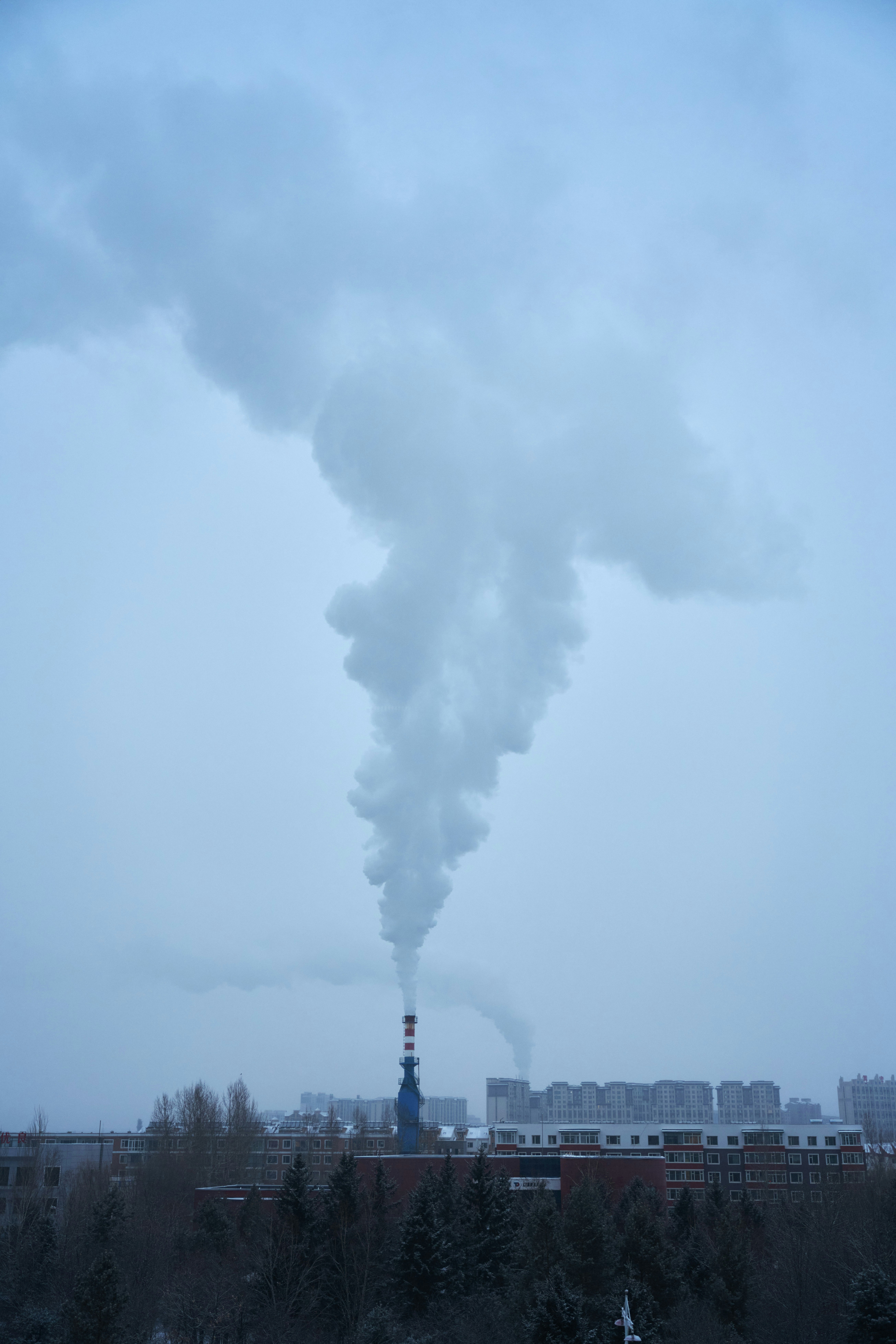 Smoke Stack Symmetry over a Cold Cityscape