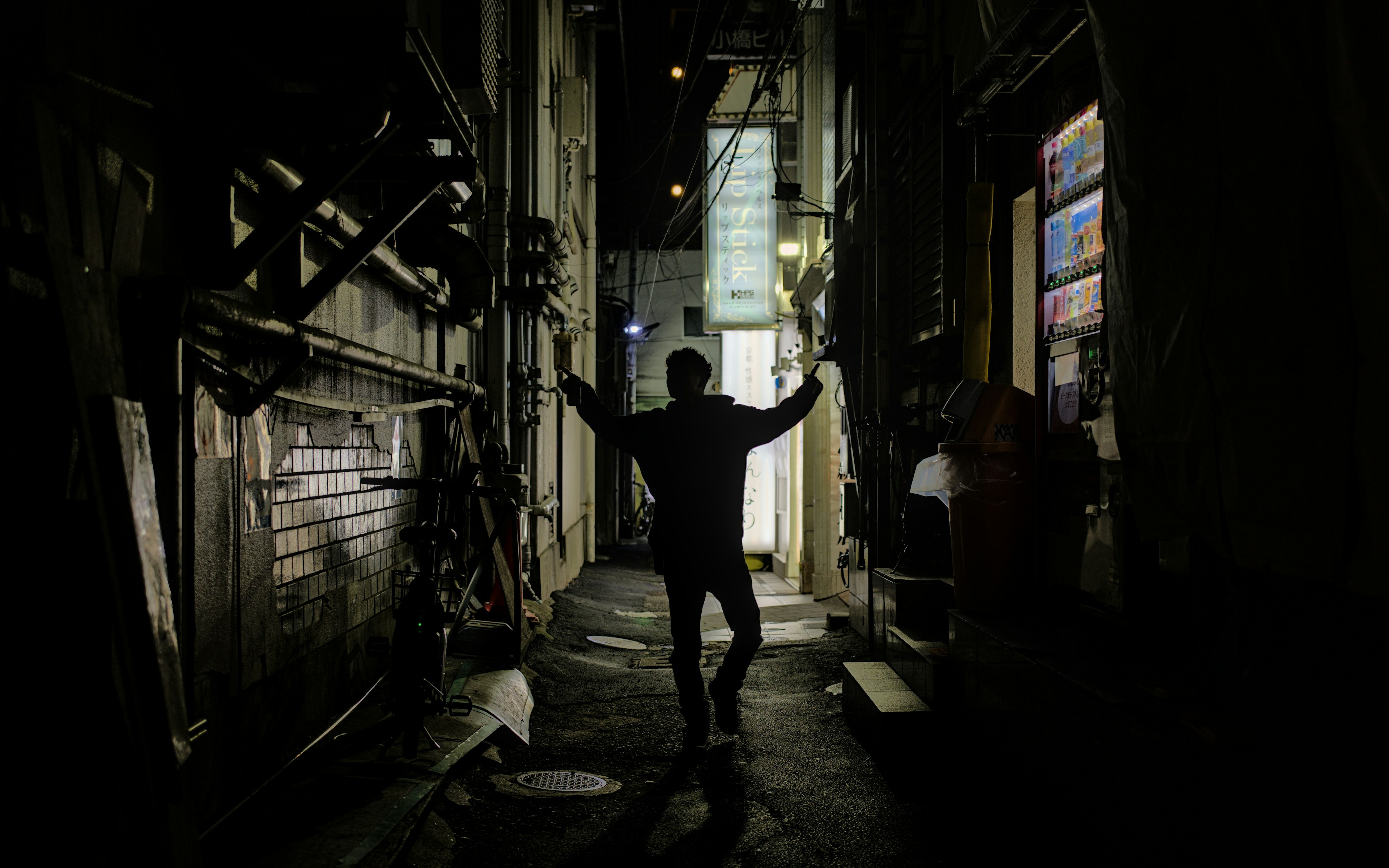 Someone strikes a pose in a dark Kyoto side alley. 2026-03-13