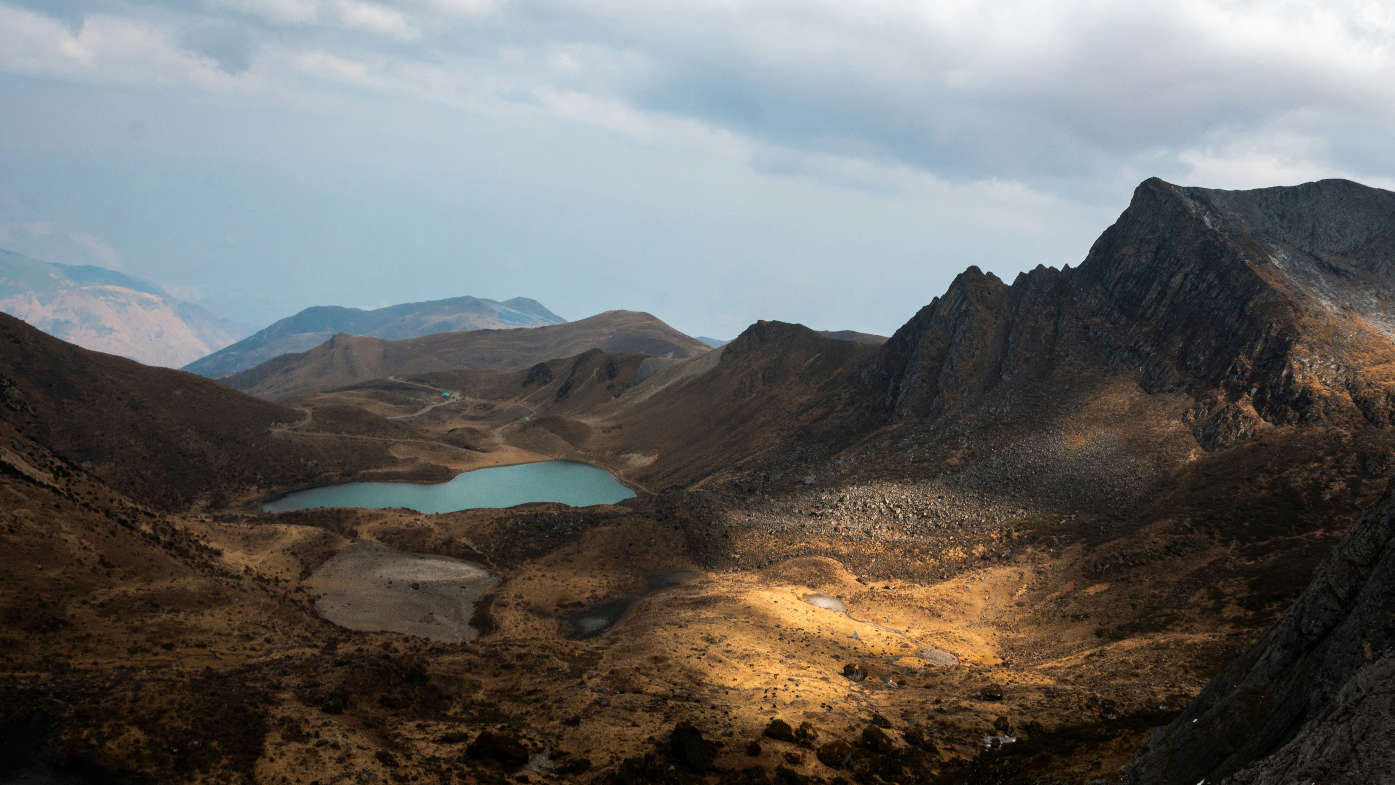 A Sunlit Basin Crowned by Rugged Peaks